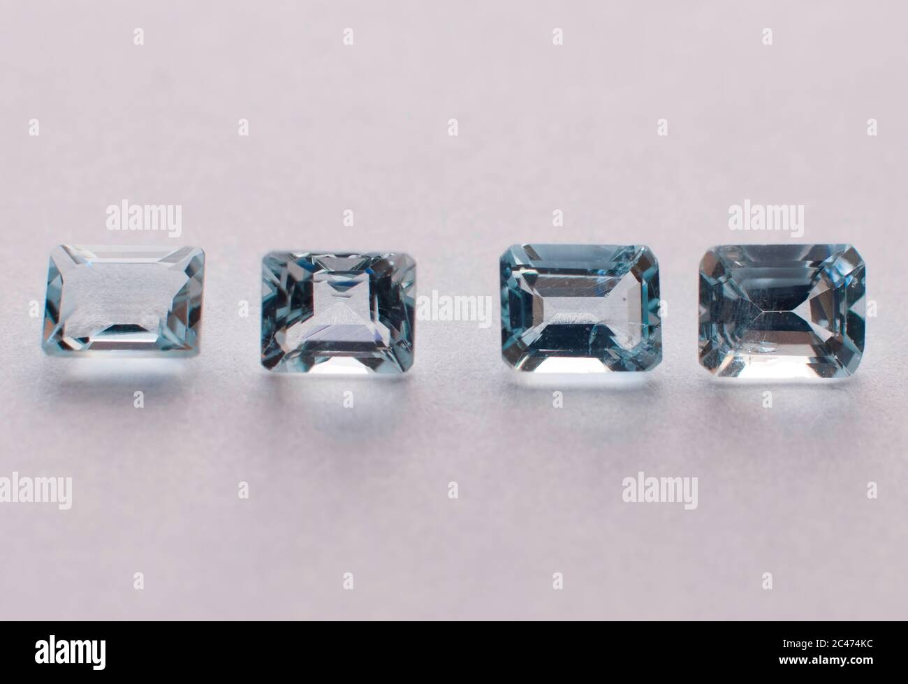 Natural faceted blue aquamarine on the white background Stock Photo - Alamy