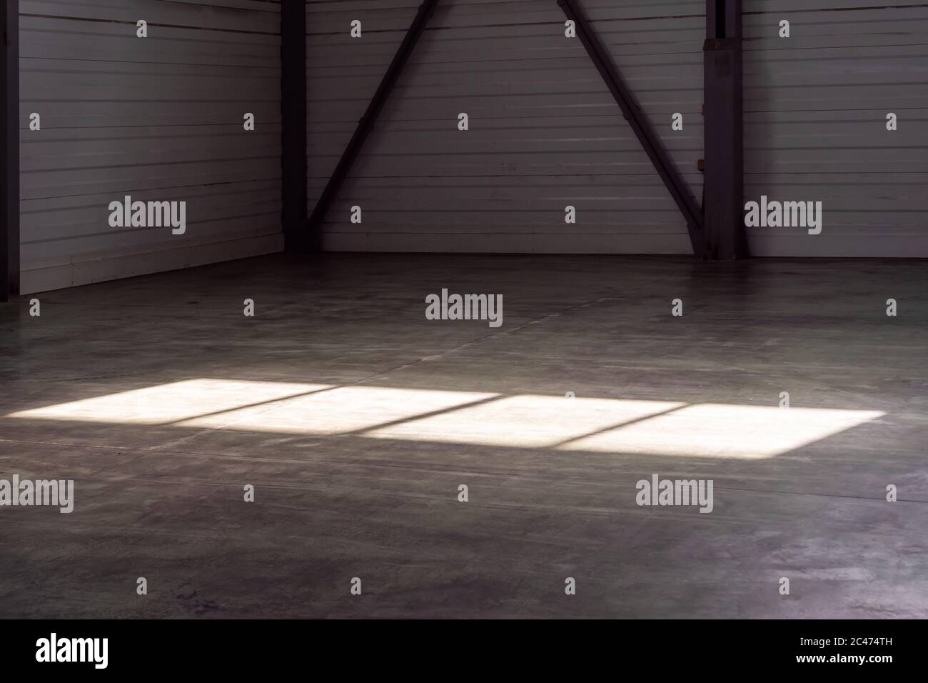 An empty warehouse is a large room Stock Photo - Alamy