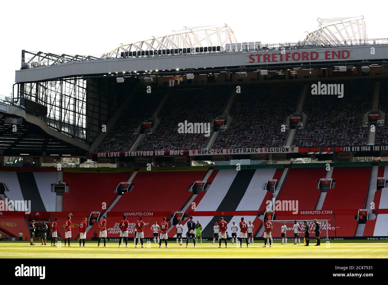 A minutes silence before the match for ex player Tony Dunne during the ...