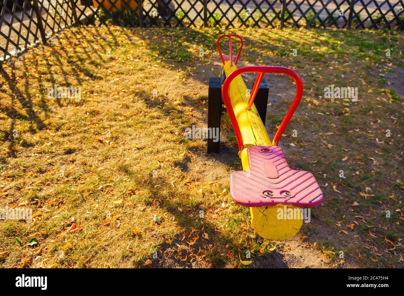 Old colorful seesaw in a playground during daytime Stock Photo - Alamy