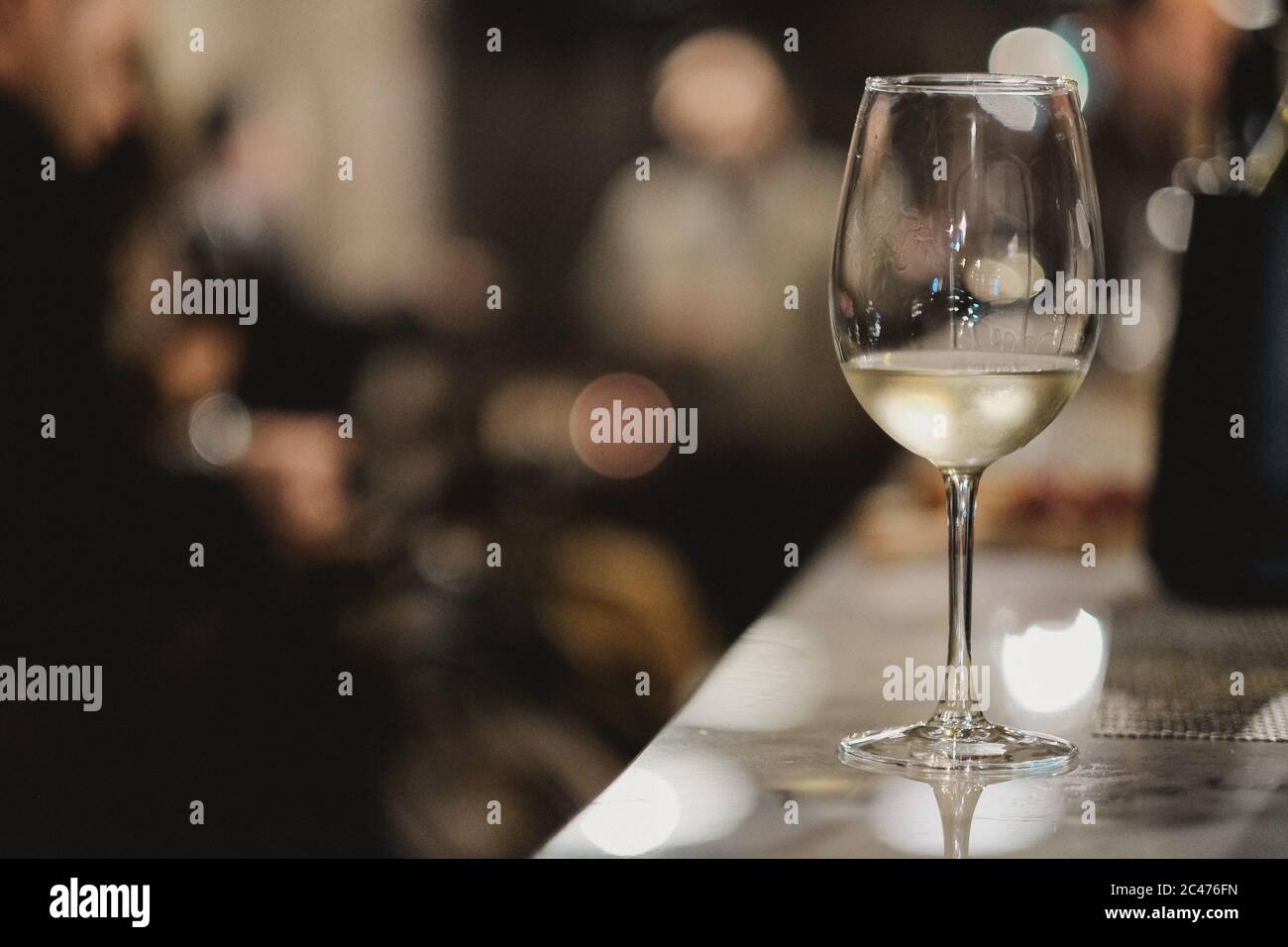 Shallow focus shot of a glass of white wine Stock Photo - Alamy