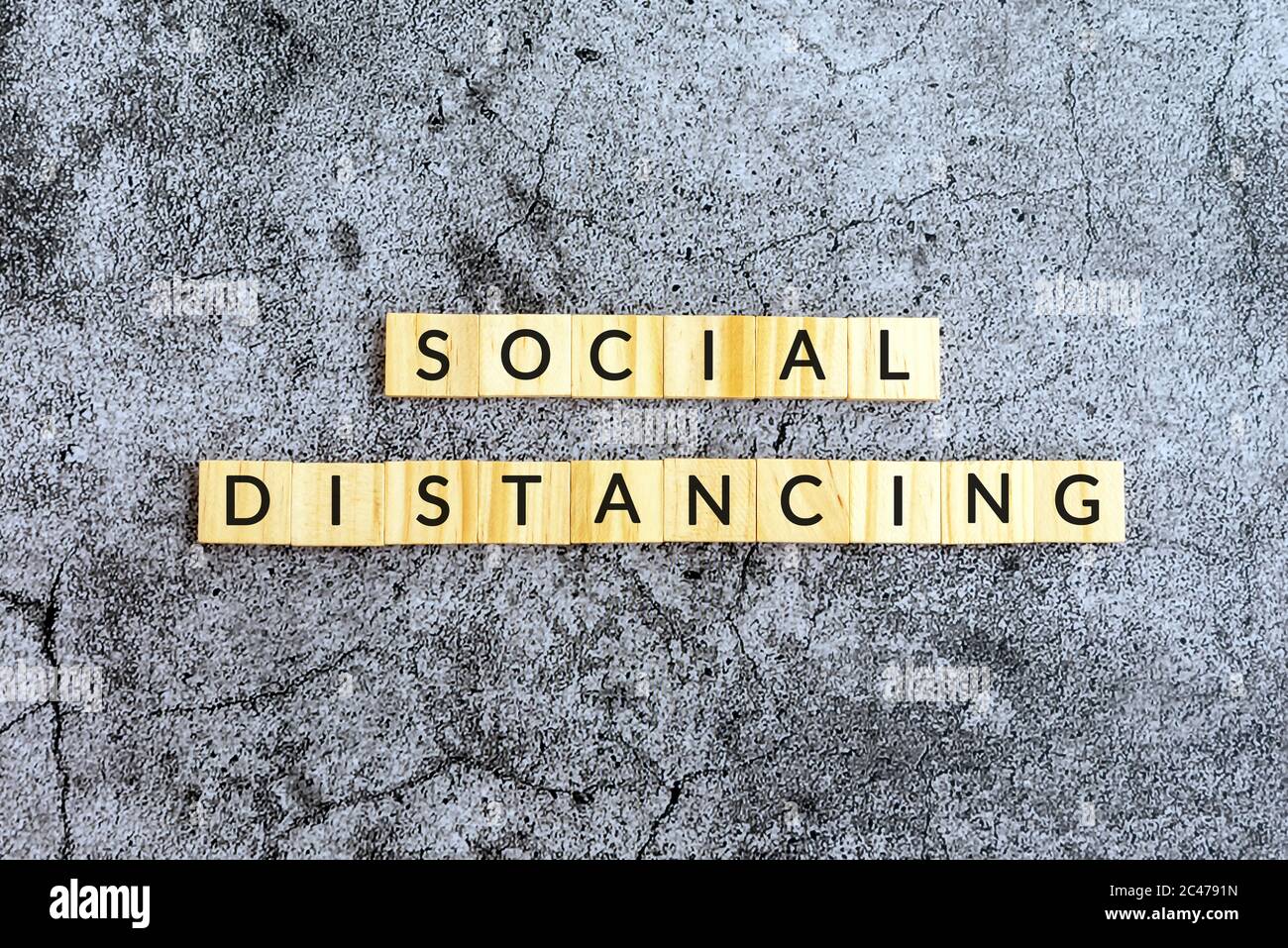 Social distancing text on wooden block textures background Stock Photo ...