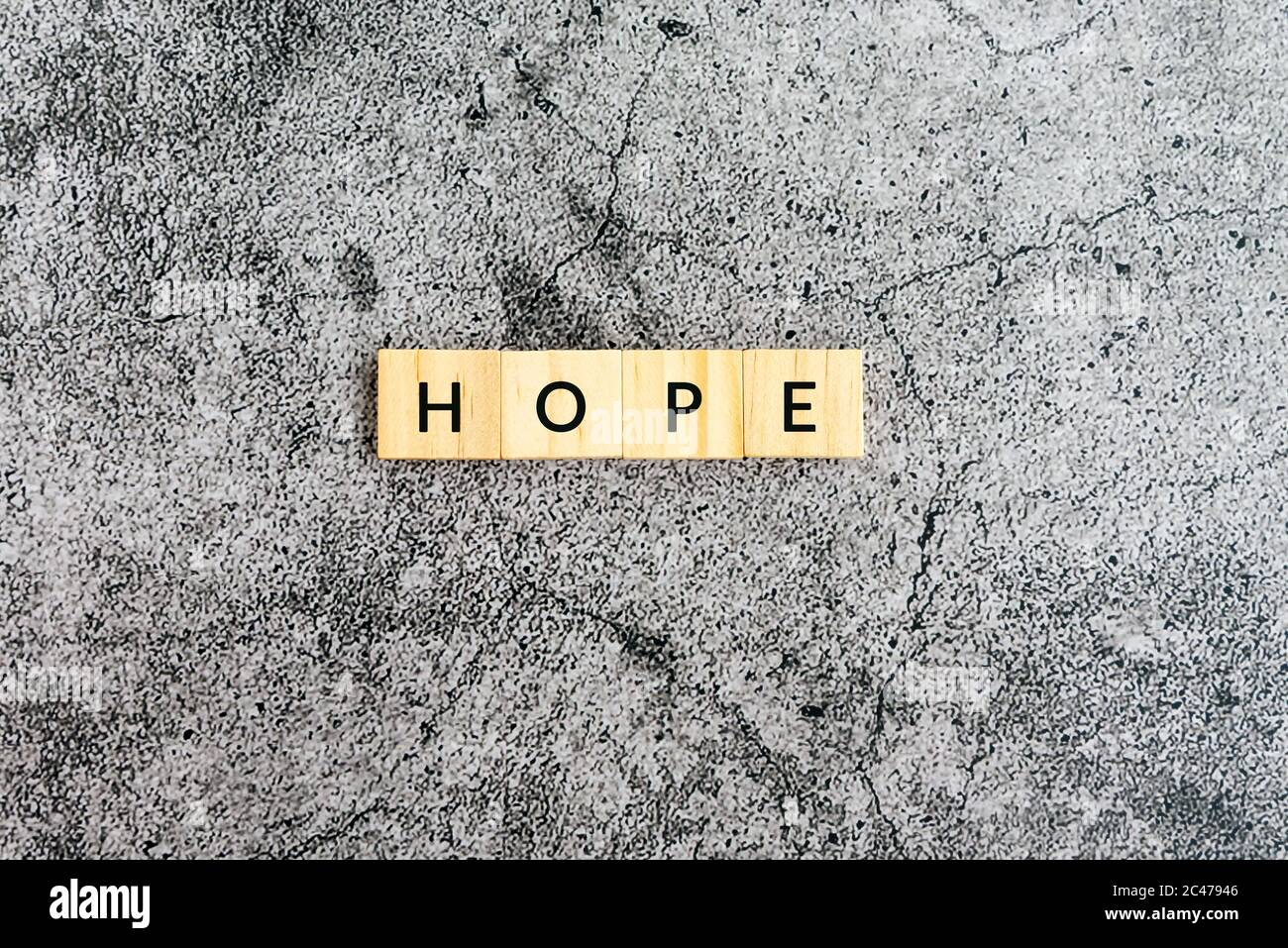 Hope text on wooden block textures background Stock Photo - Alamy
