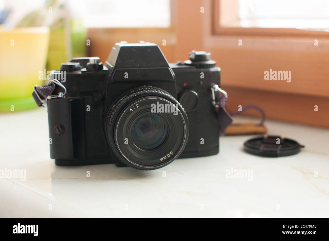 Old black film camera with lens Stock Photo - Alamy