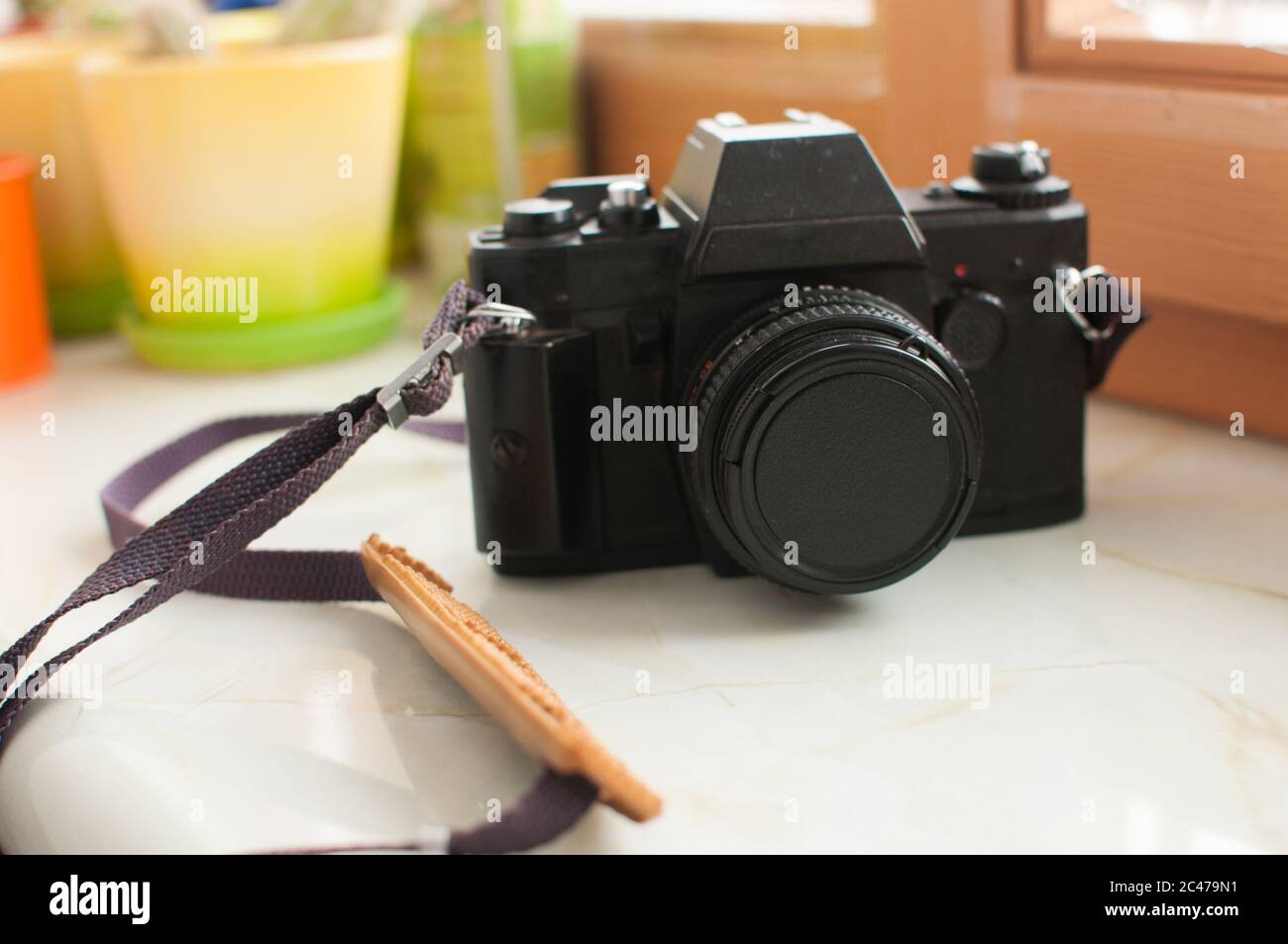 Old black film camera with lens Stock Photo - Alamy