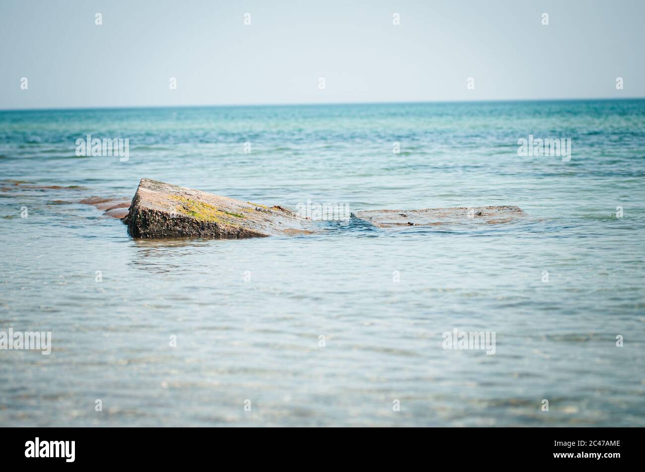 Old concrete blocks in the sea water Stock Photo - Alamy