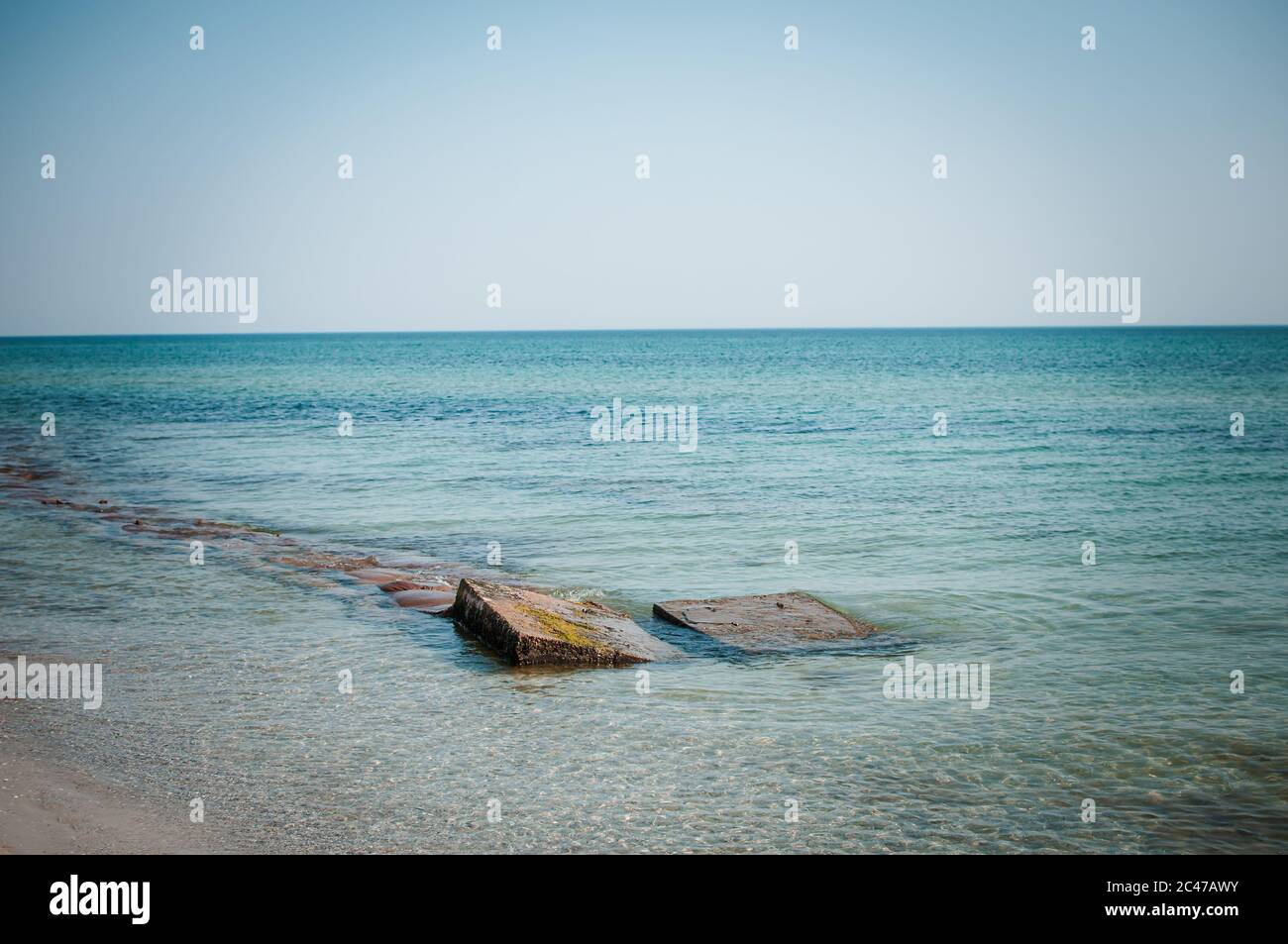 Old concrete blocks in the sea water Stock Photo - Alamy