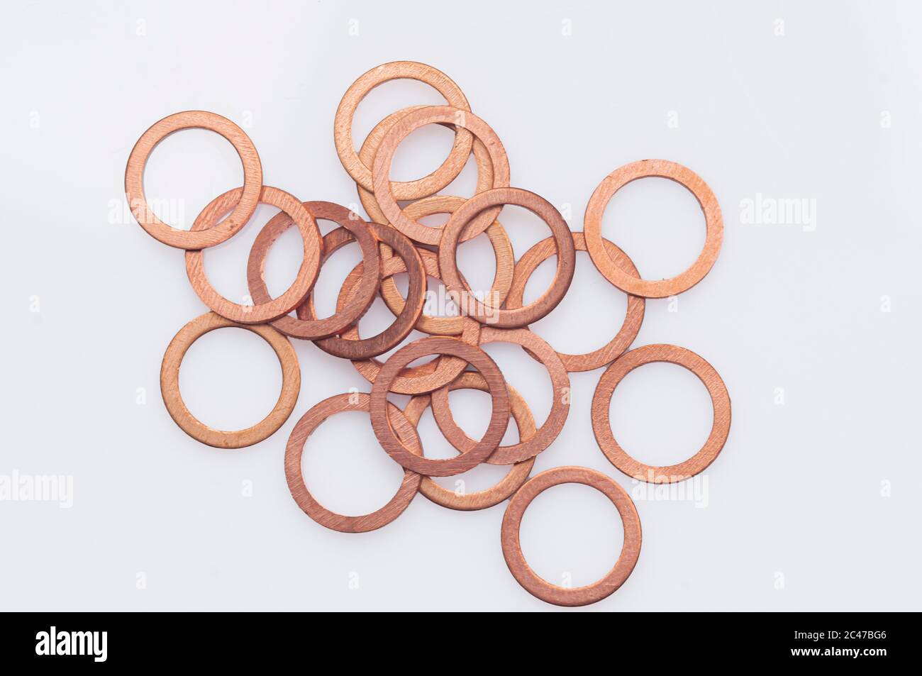 many O copper rings on the white background Stock Photo - Alamy