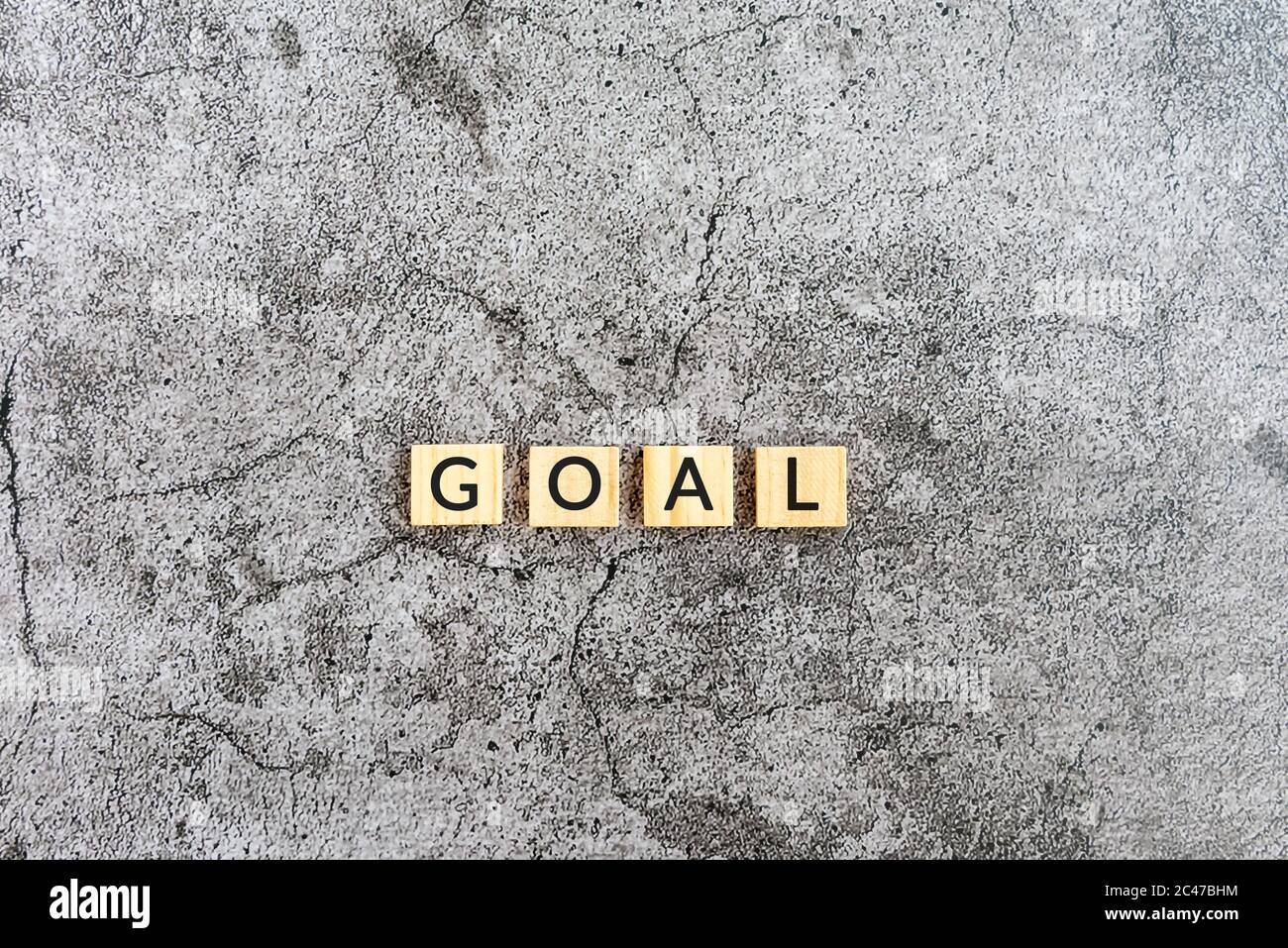 Goal text on wooden block textures background Stock Photo - Alamy