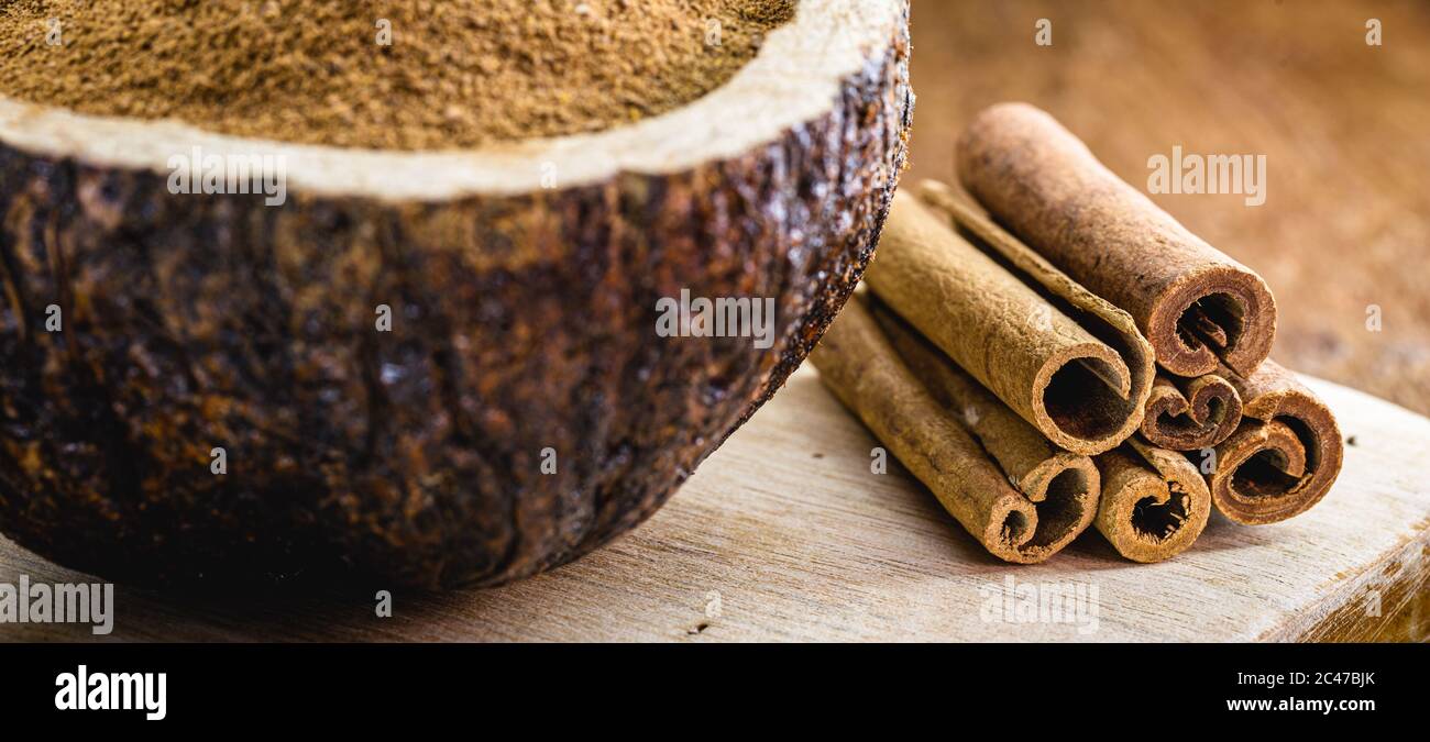 cinnamon in a rustic pot, made from coconut shell, ground cinnamon used ...