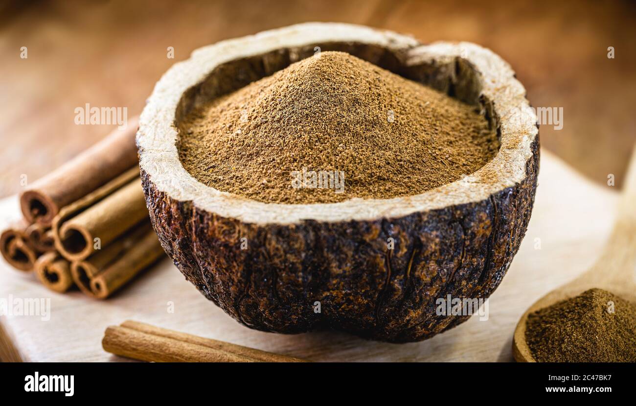 cinnamon in a rustic pot, made from coconut shell, ground cinnamon used ...