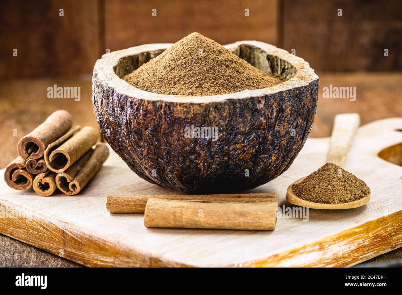cinnamon in a rustic pot, made from coconut shell, ground cinnamon used ...