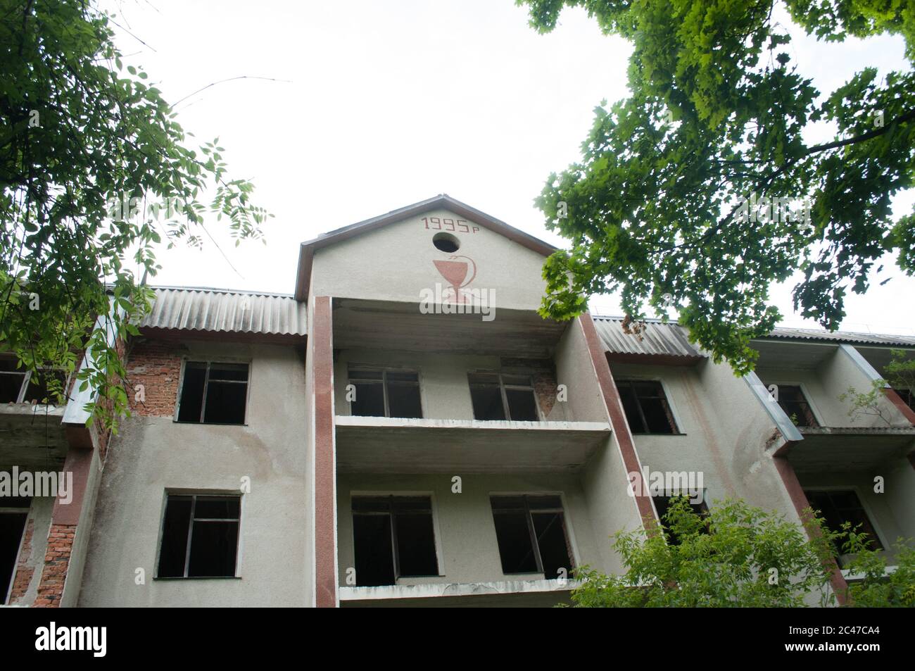 Front exterior view of the abandoned hospital Stock Photo - Alamy