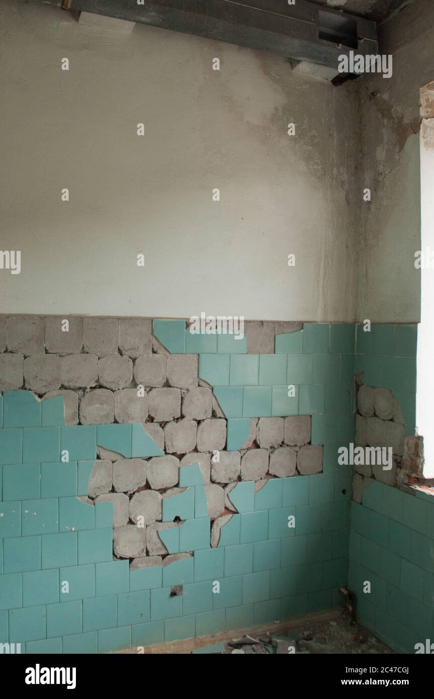 Ruined room with fallen blue tile Stock Photo - Alamy