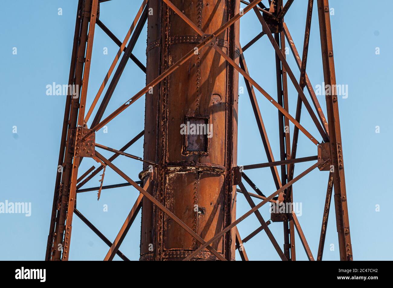 Old abandoned steel rusty lighthouse on the beach on the Dzharylgach ...
