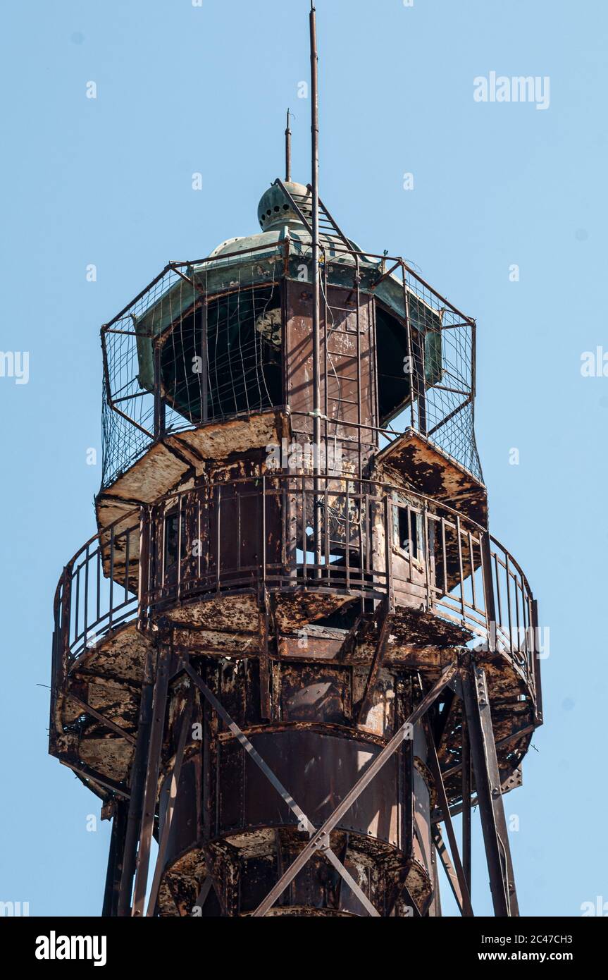 Old abandoned steel rusty lighthouse on the beach on the Dzharylgach ...