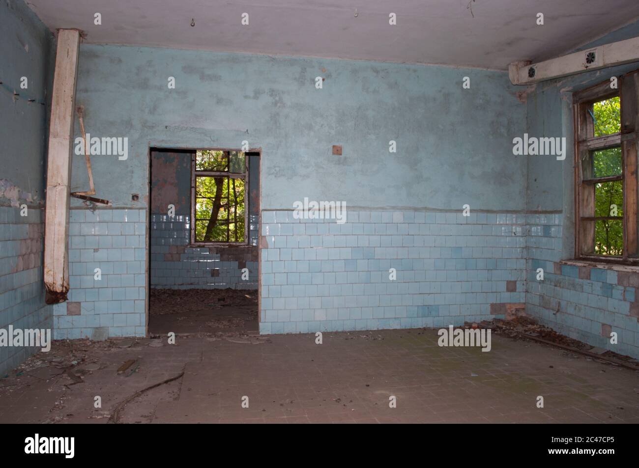 Blue room with the doorway and windows in the abandoned chemical ...
