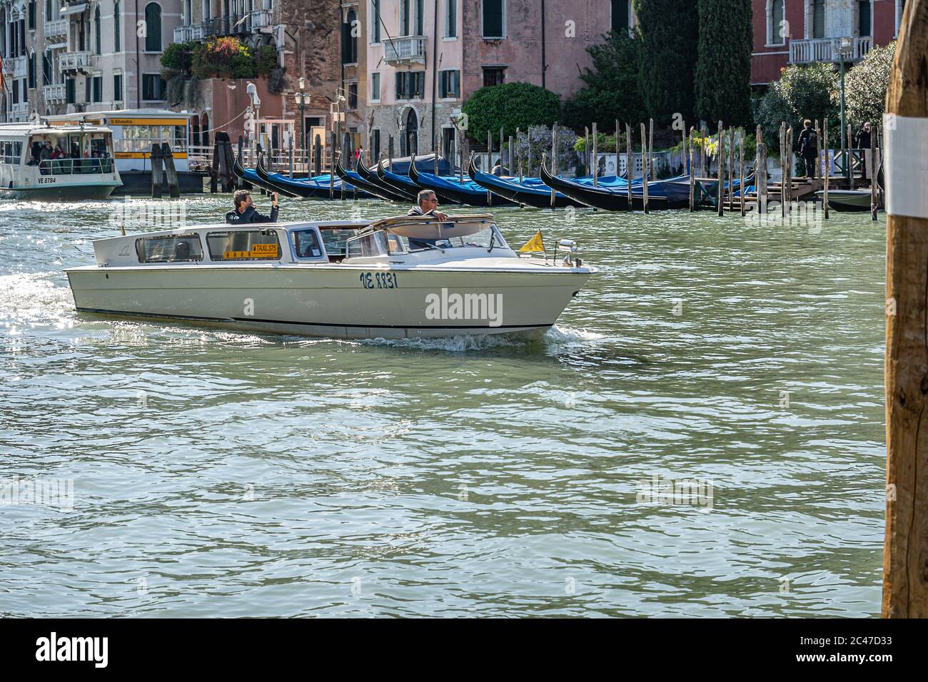 Water Taxi - Venice, Italy with tourist taking photographs Stock Photo ...