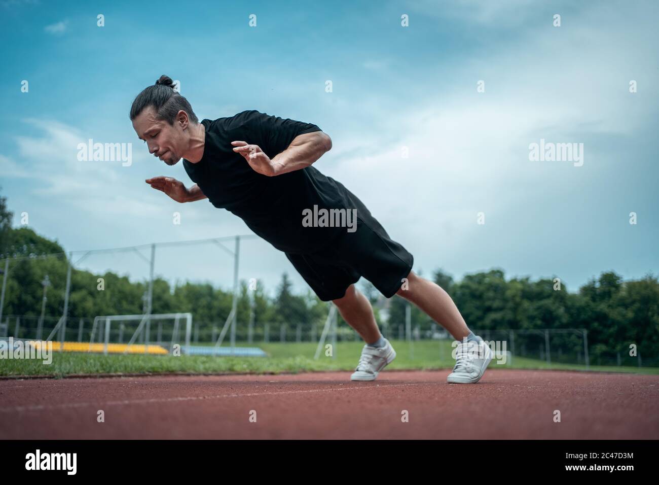 young athlete push up and jump at stadium outdoor Stock Photo - Alamy