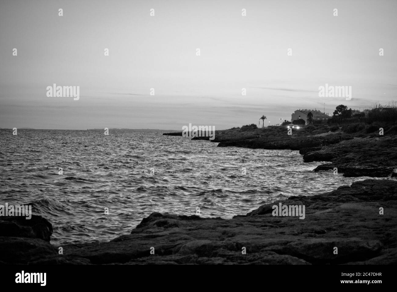 Dark black coastal rocks hi-res stock photography and images - Alamy