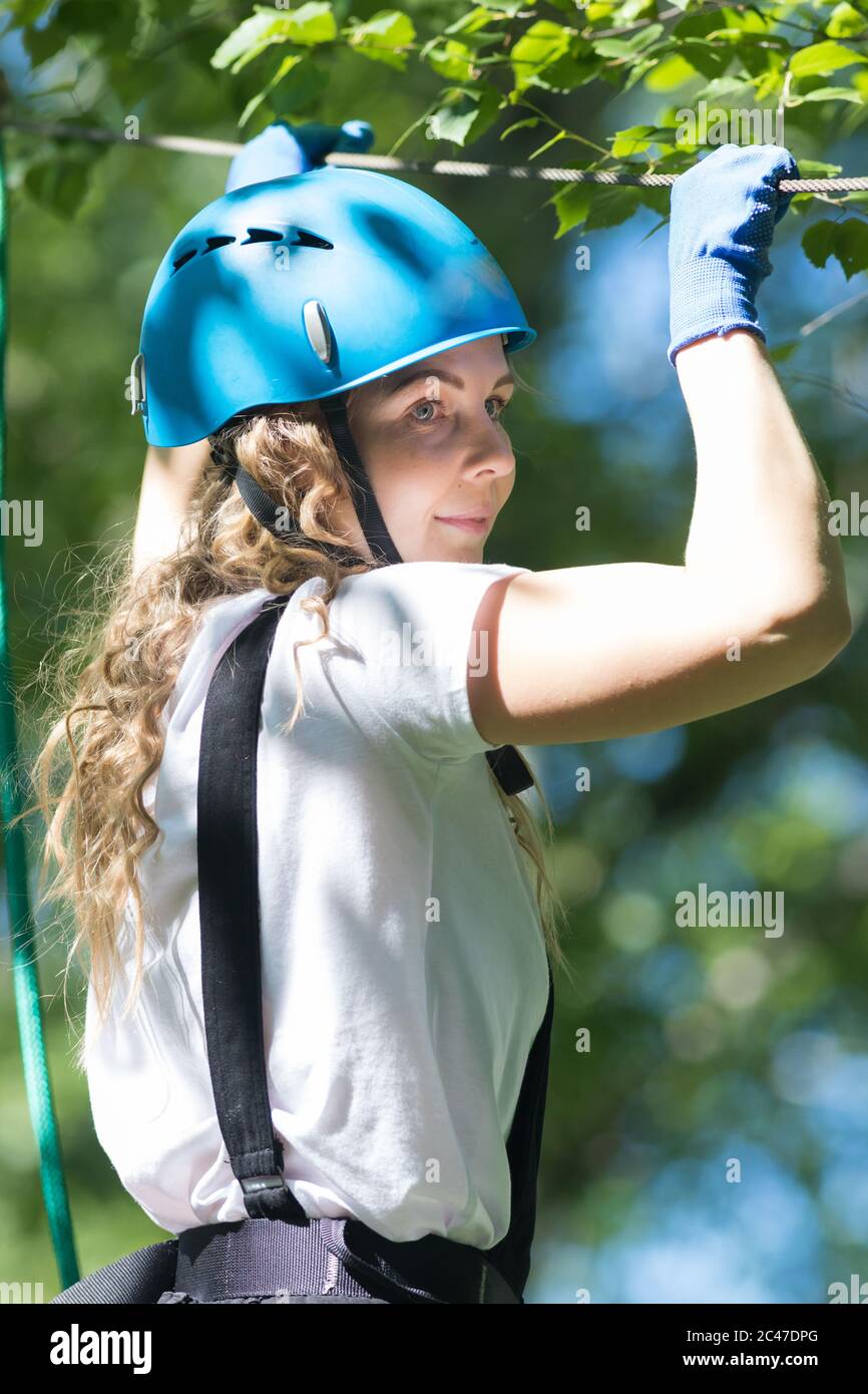 Woman walking across ladder hi-res stock photography and images - Alamy