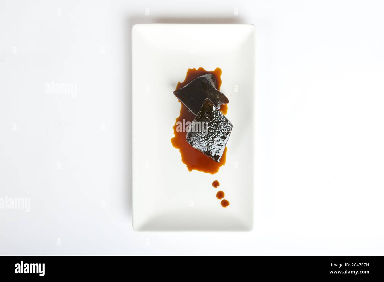 Top view of a dinner served in a white plate isolated in a white ...
