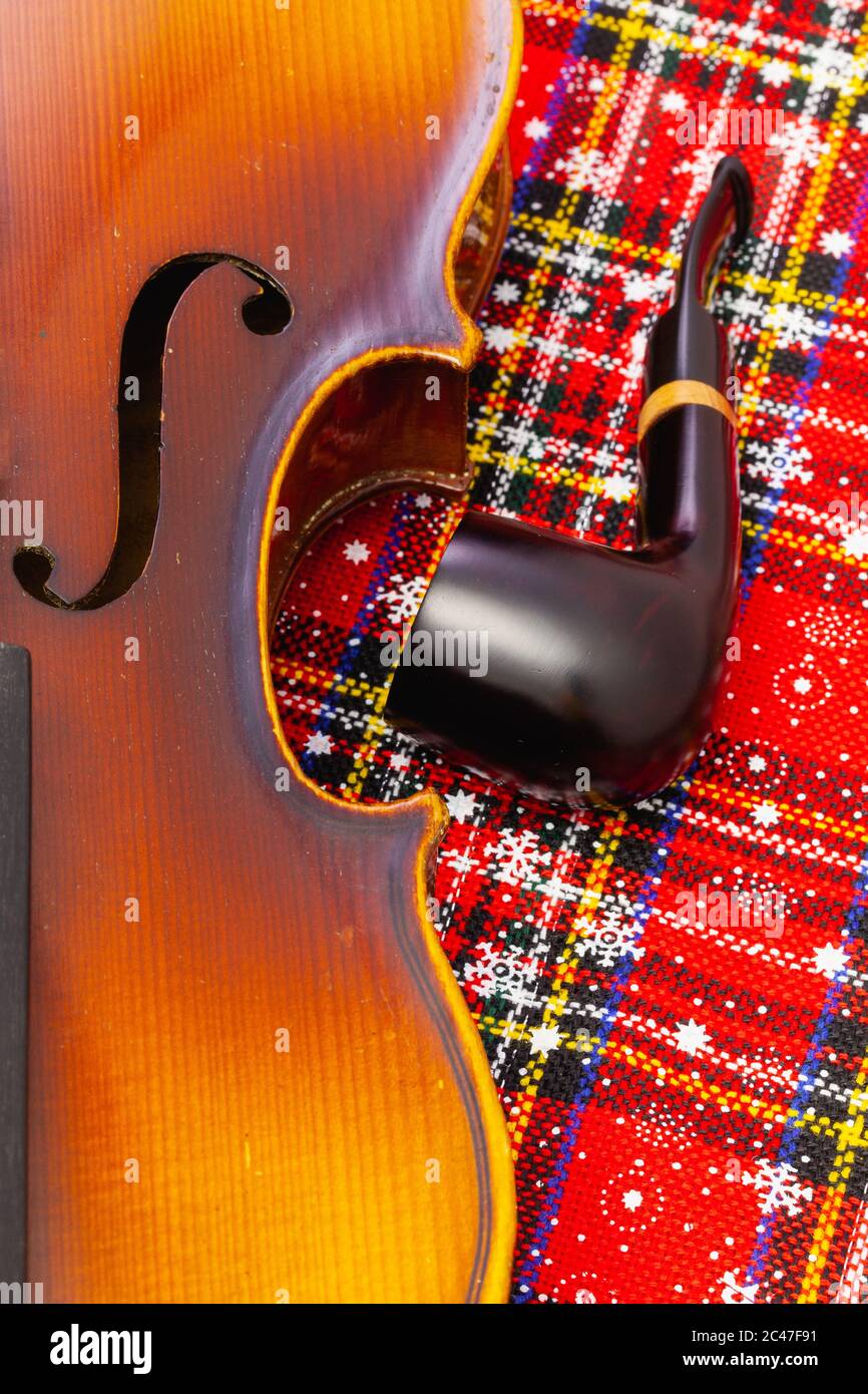 Photo of old violin and luxury wooden pipe on Christmas decoration ...