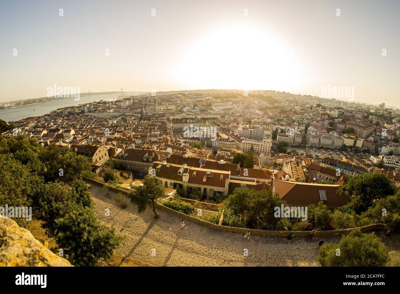 Fisheye view of the sun shining over the buildings of the city Stock ...
