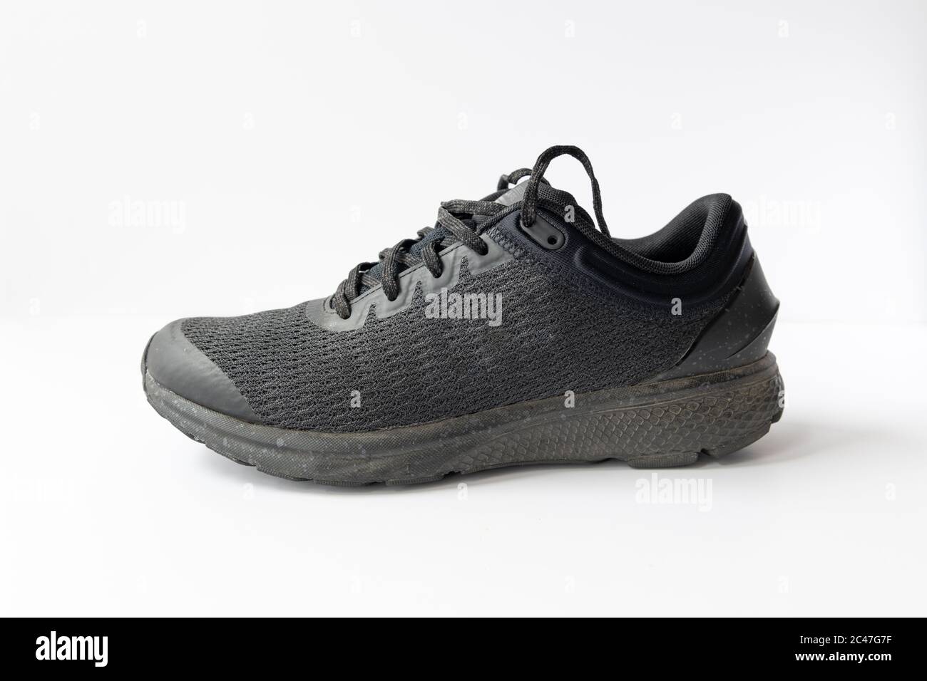 Isolated image of a black trainer, running shoe Stock Photo - Alamy