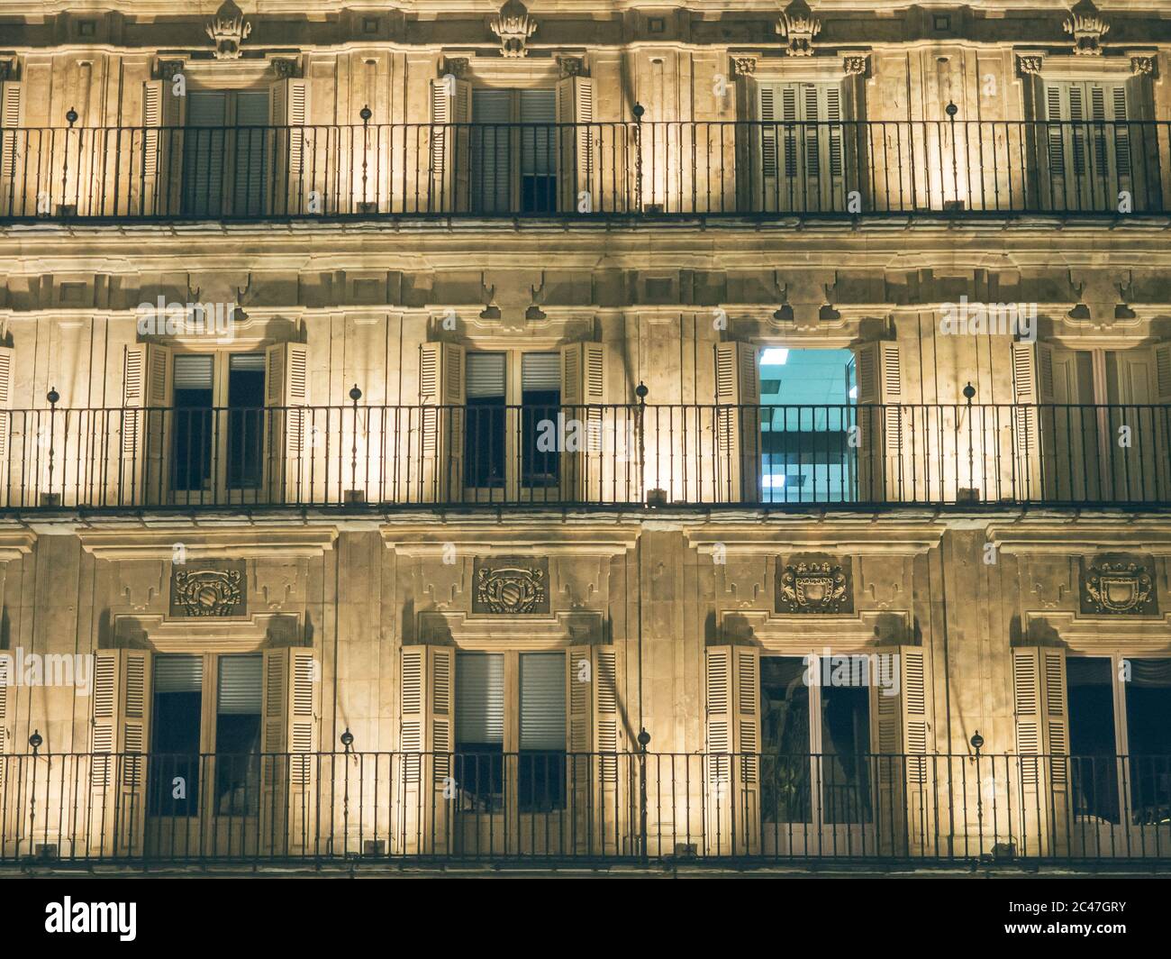 Old building with windows and beautiful carvings at night time Stock ...
