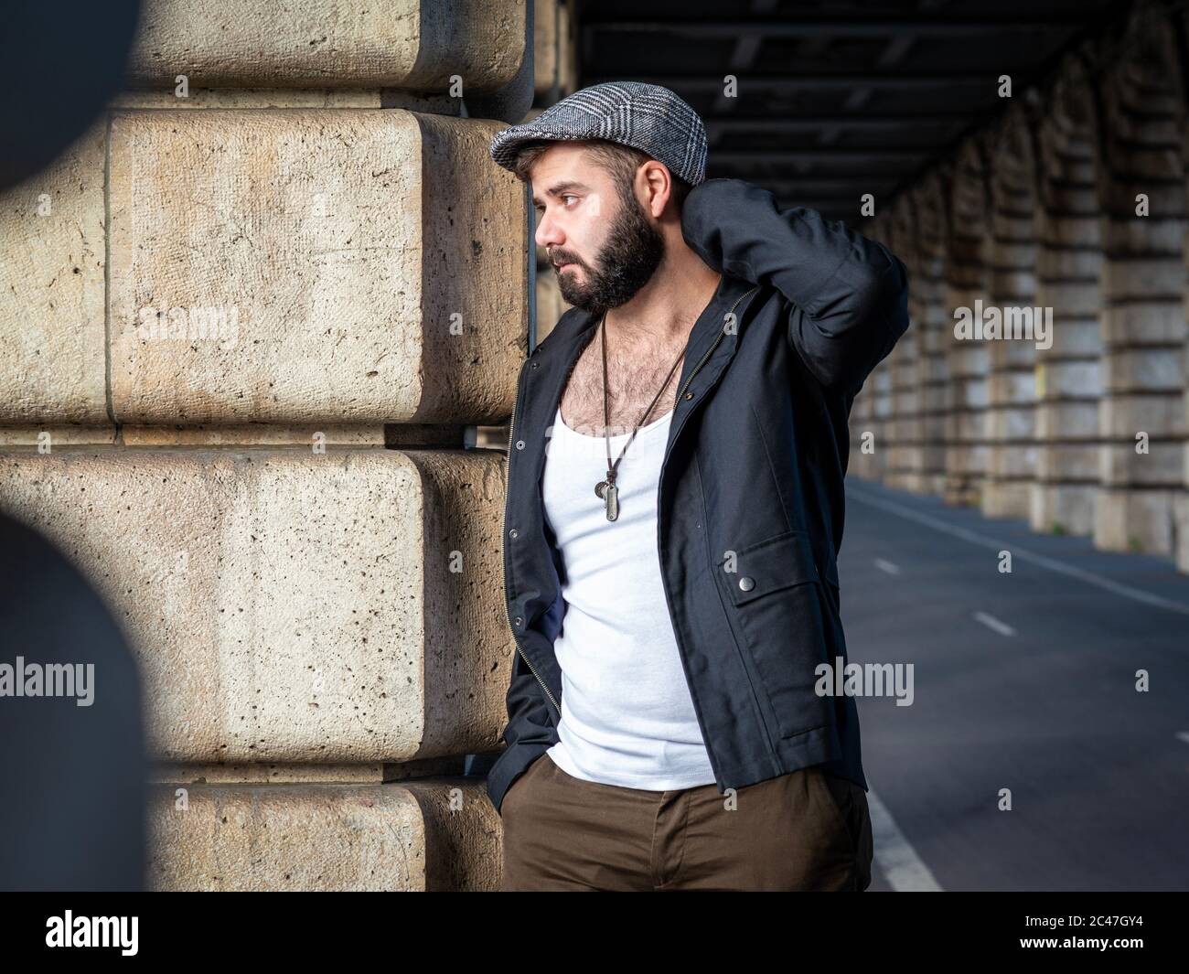 Young french bearded man, taken outside under a bridge with natural ...