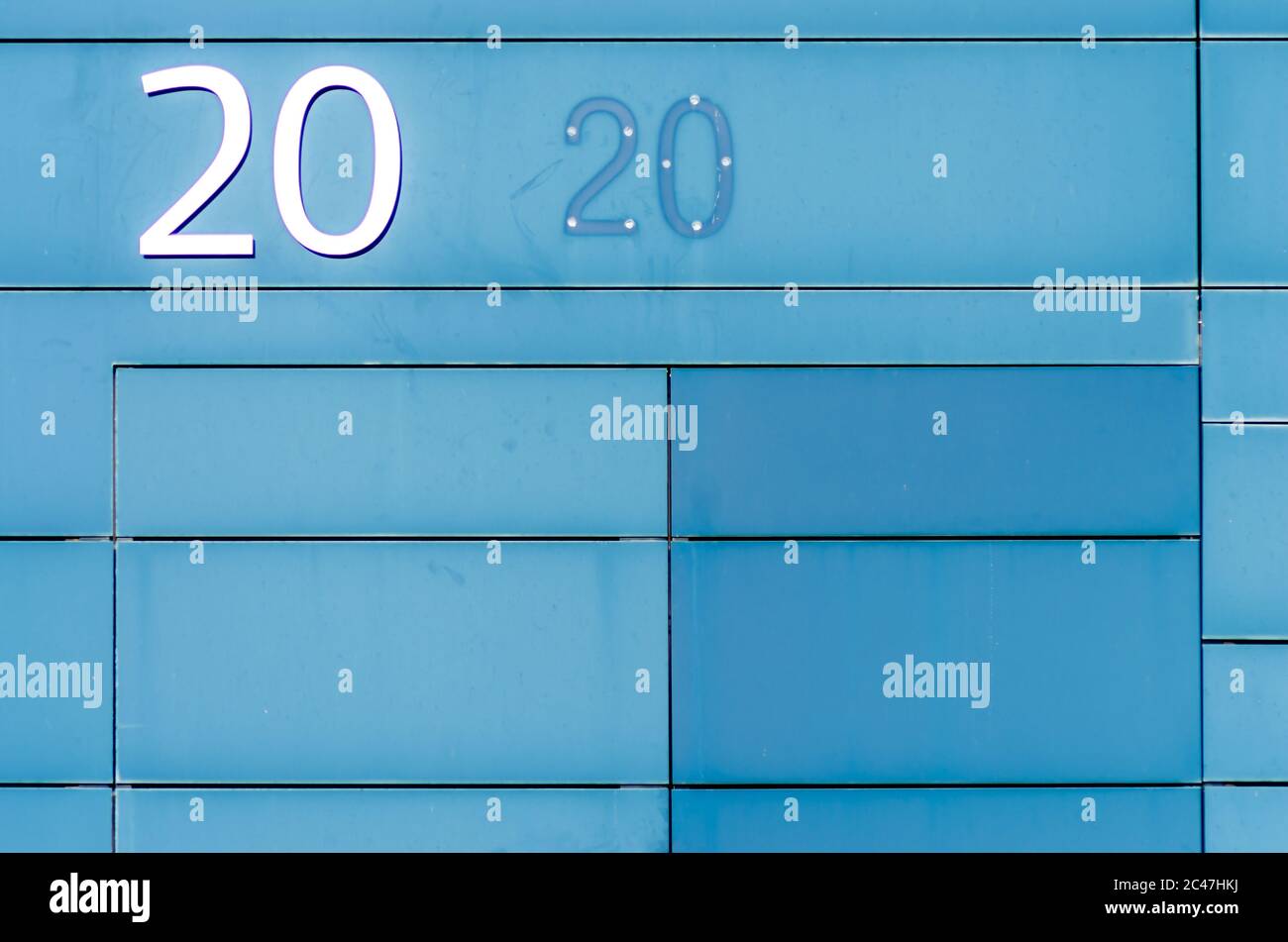 Number 2020 on a wall with different shades of blue Stock Photo - Alamy