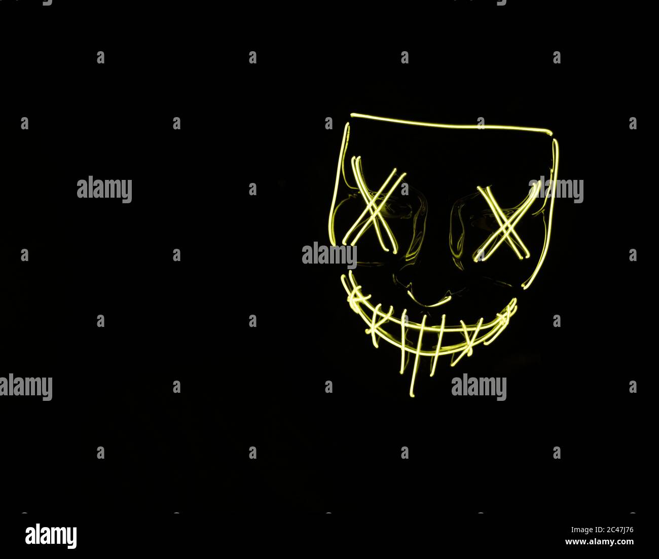 Closeup shot of a yellow purge led mask isolated on a black background ...