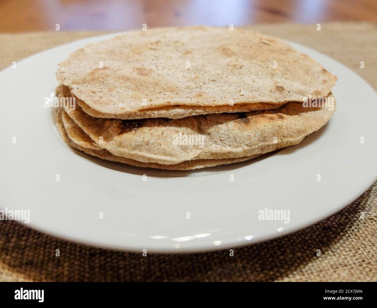 Indian homemade chapati. Chapati is a flat bread from India, made with ...