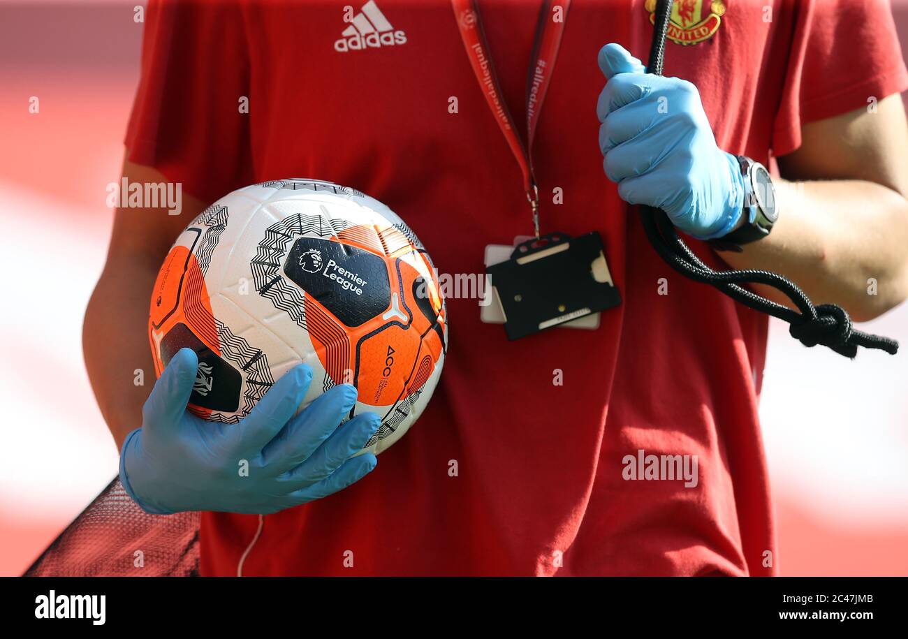 A disinfected match ball with a member of the ground staff during the ...