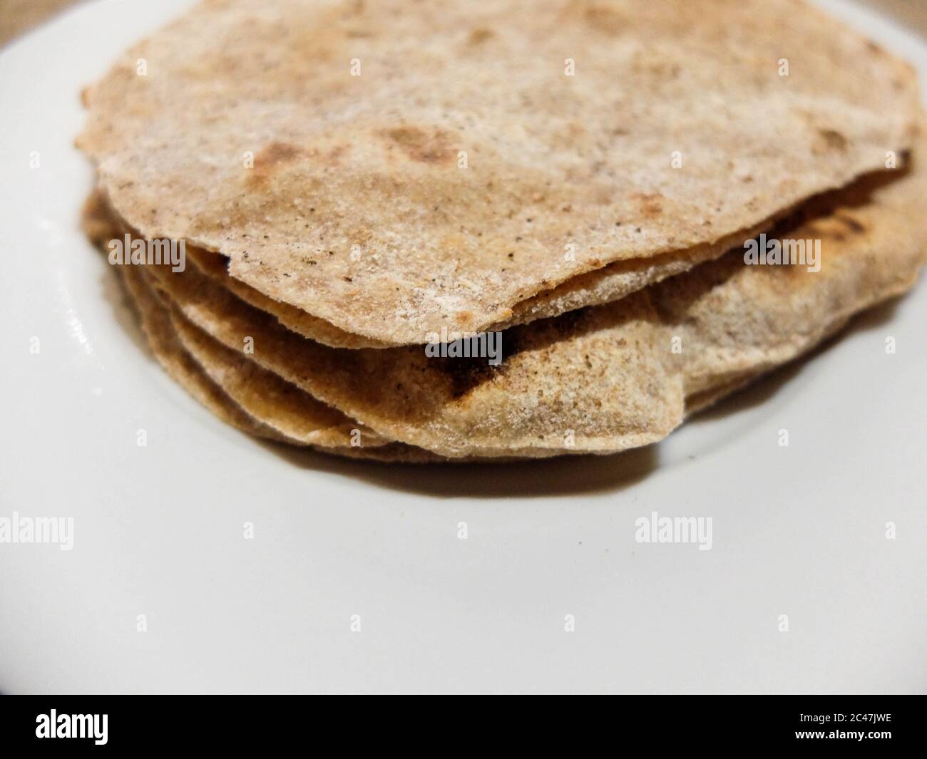 Indian homemade chapati. Chapati is a flat bread from India, made with ...