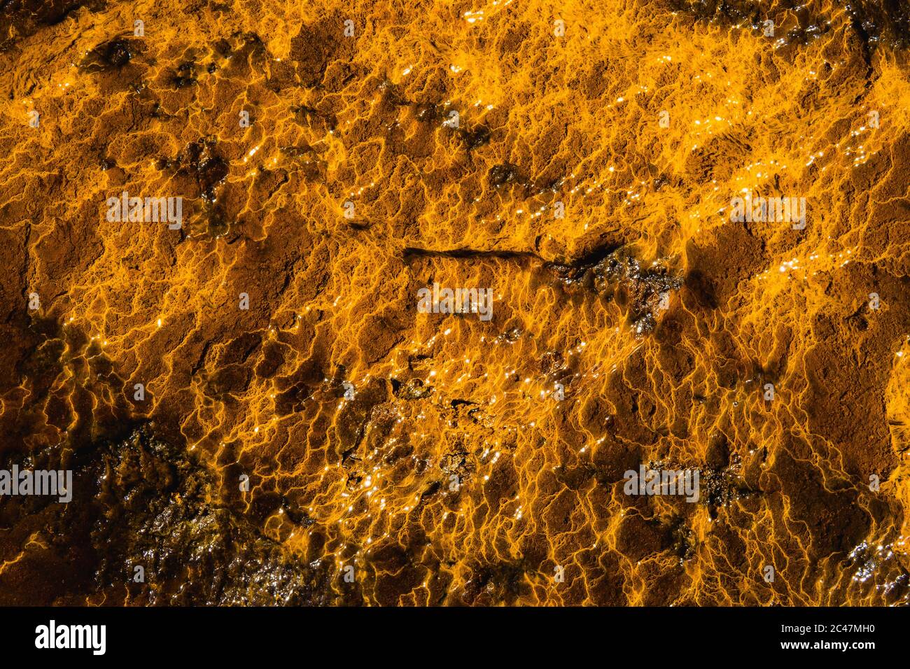 Top view shot of water flowing over the rock in a river bed in Rio ...