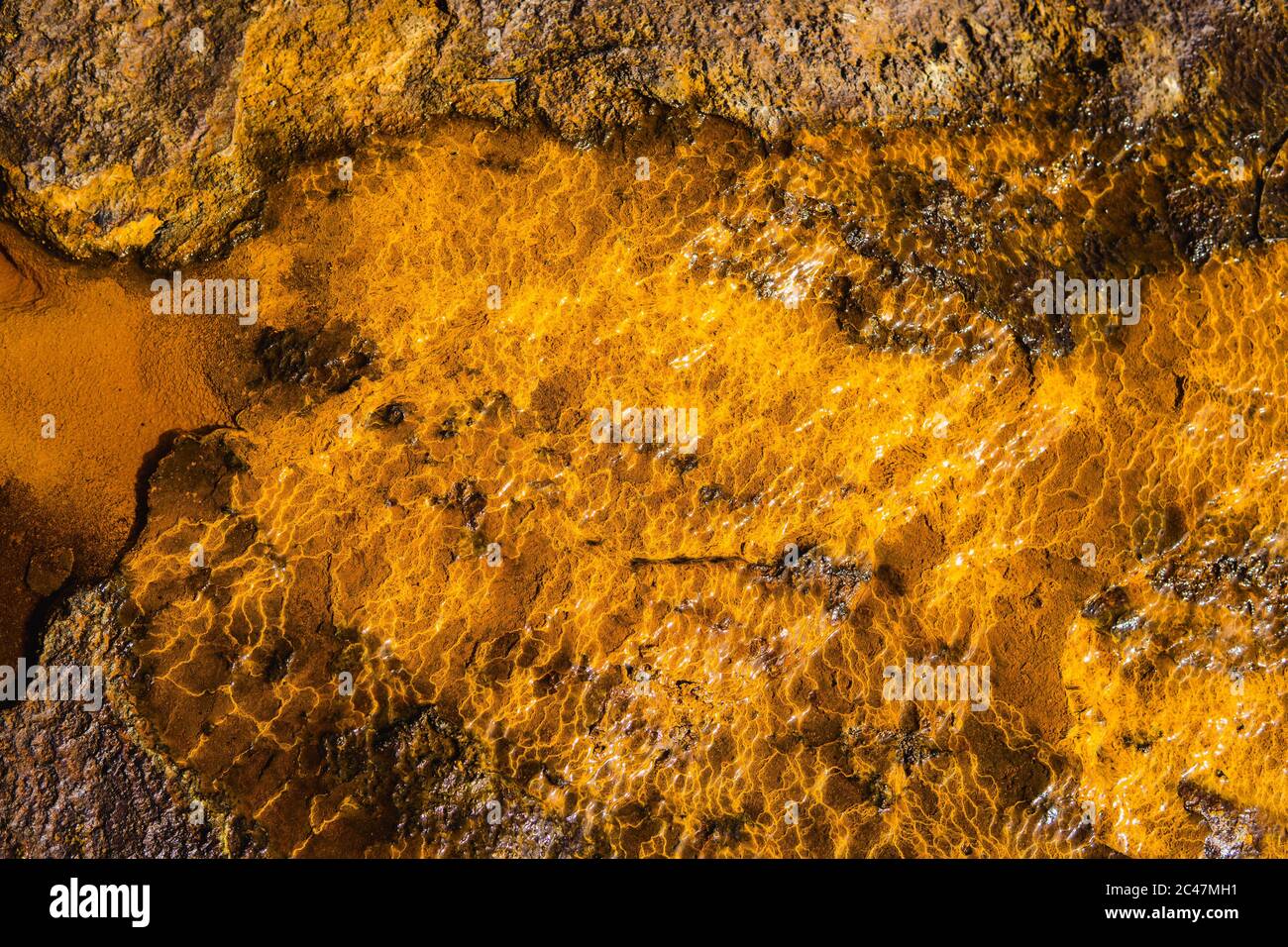 Top view shot of water flowing over the rock in a river bed in Rio ...