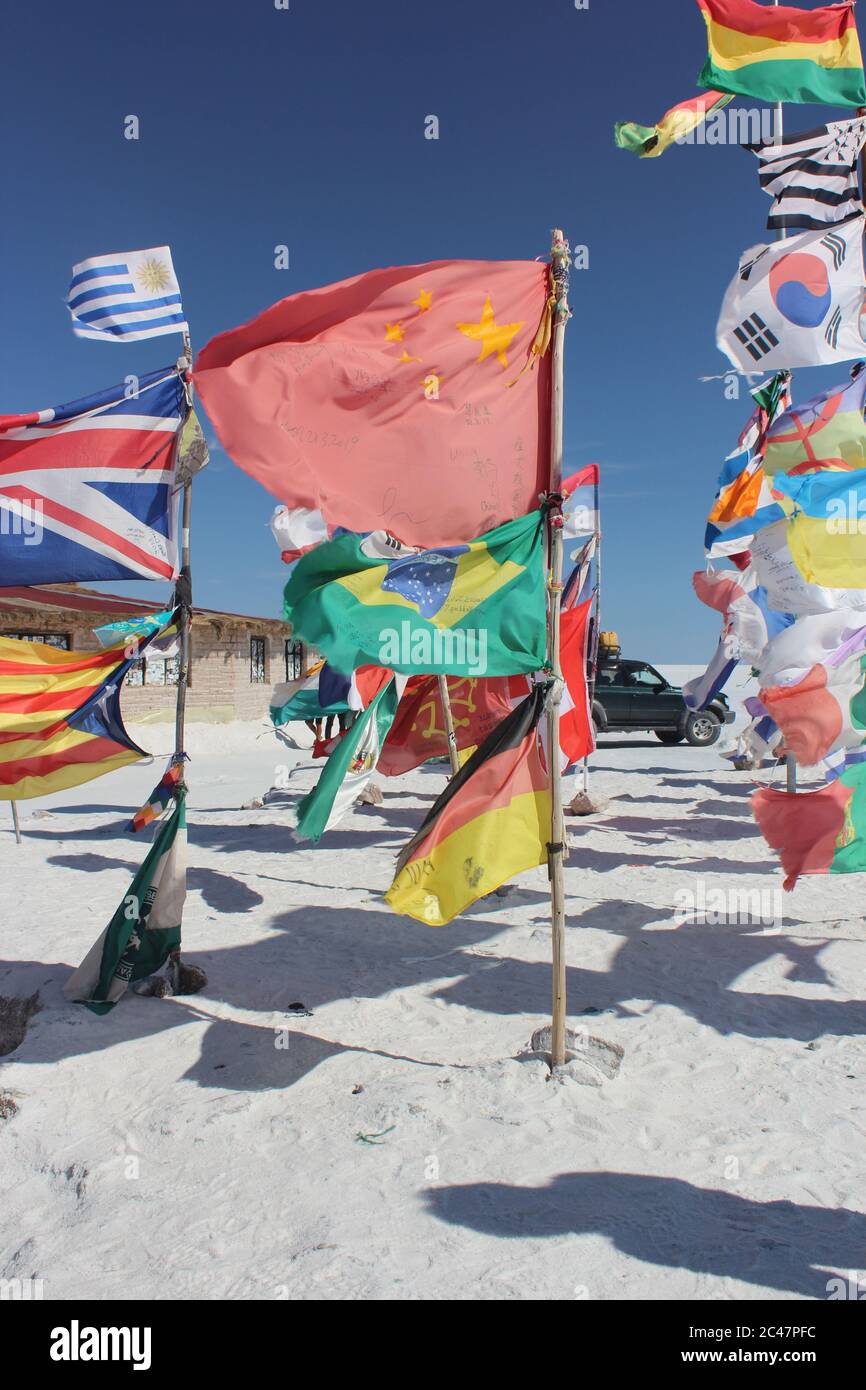 Vertical picture of flags of different countries on the snow Stock ...