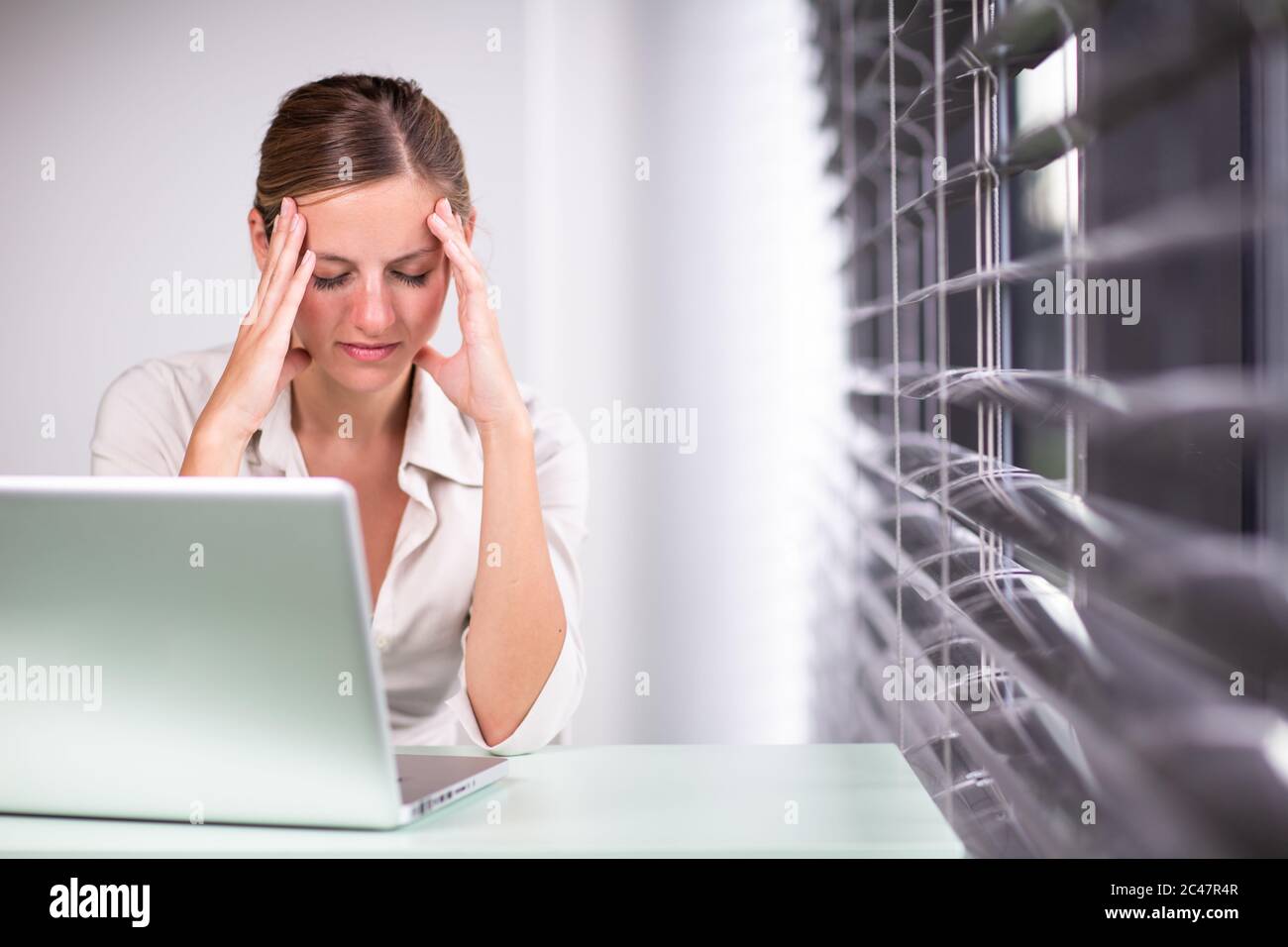 Smiling ambitious girl in suit hi-res stock photography and images - Alamy