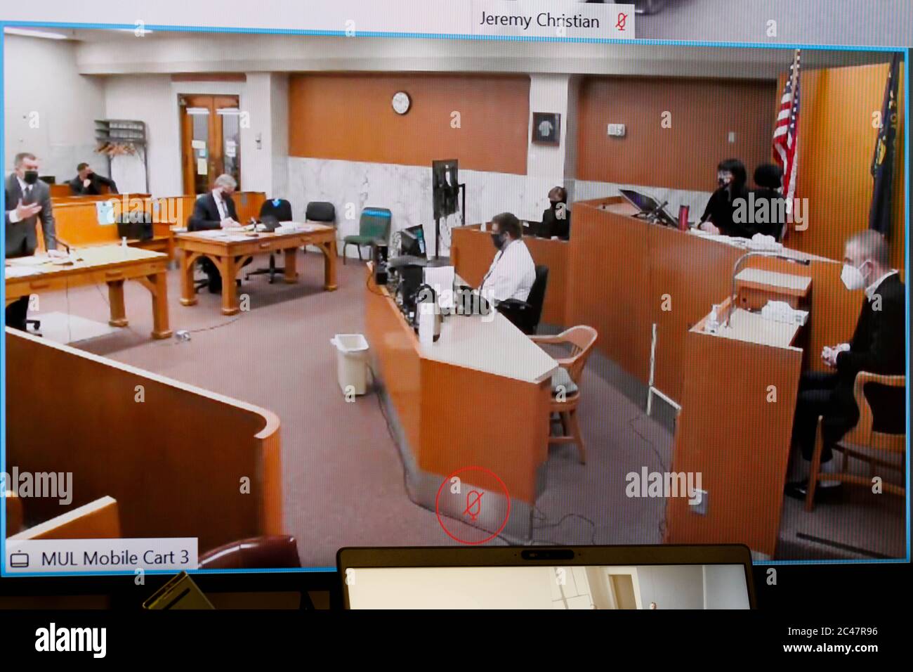 On this monitor image, stabbing survivor Micah Fletcher (R) gives a ...