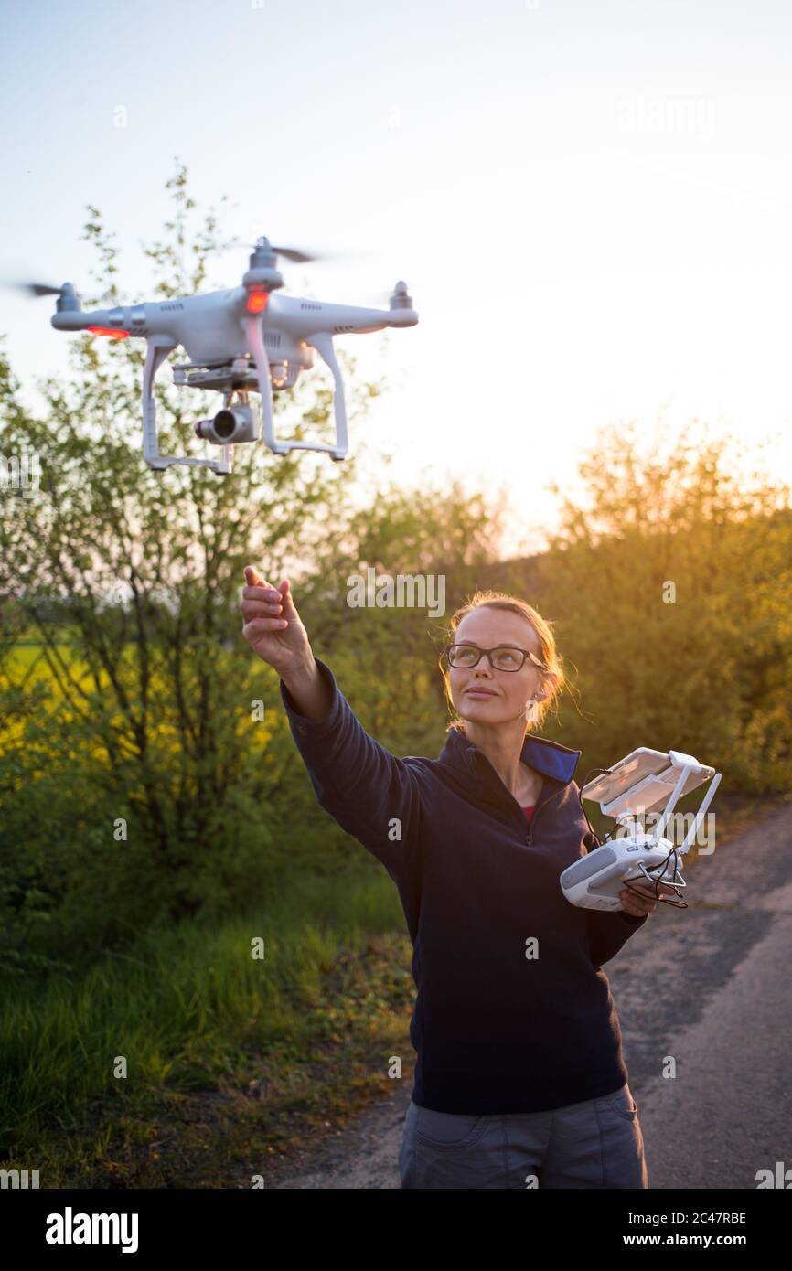 Woman piloting drone hi-res stock photography and images - Alamy