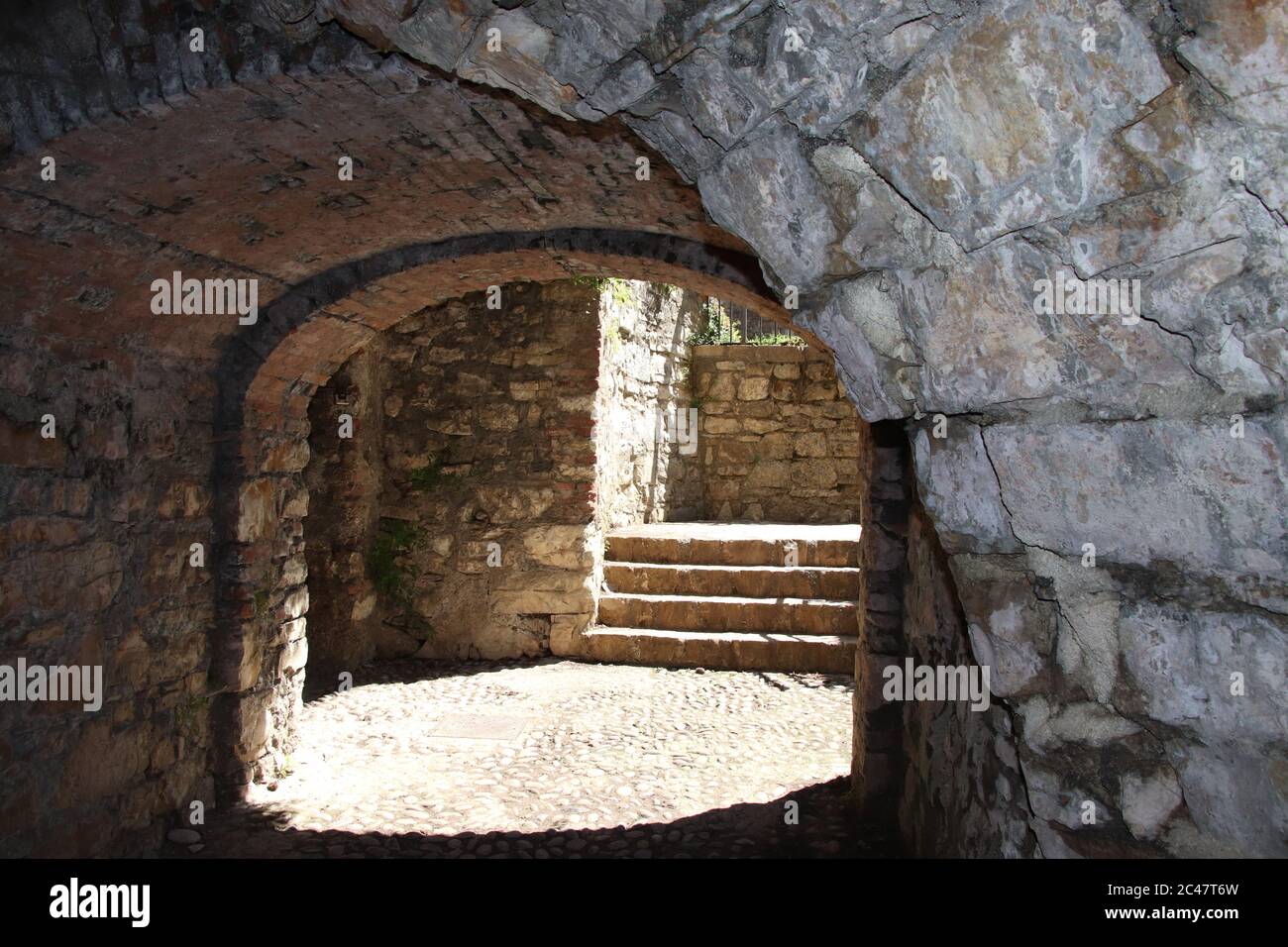 ancient dark secret passage of a castle in Italy Stock Photo - Alamy