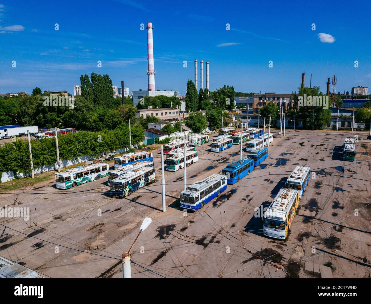 Trolleybuses in the parking lot at depot, aerial view Stock Photo - Alamy