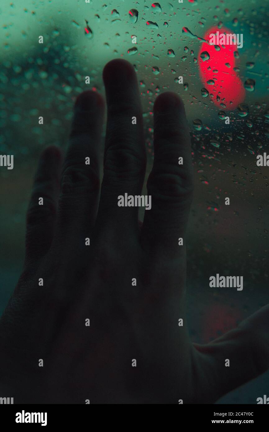 Hand against window rain hi-res stock photography and images - Alamy