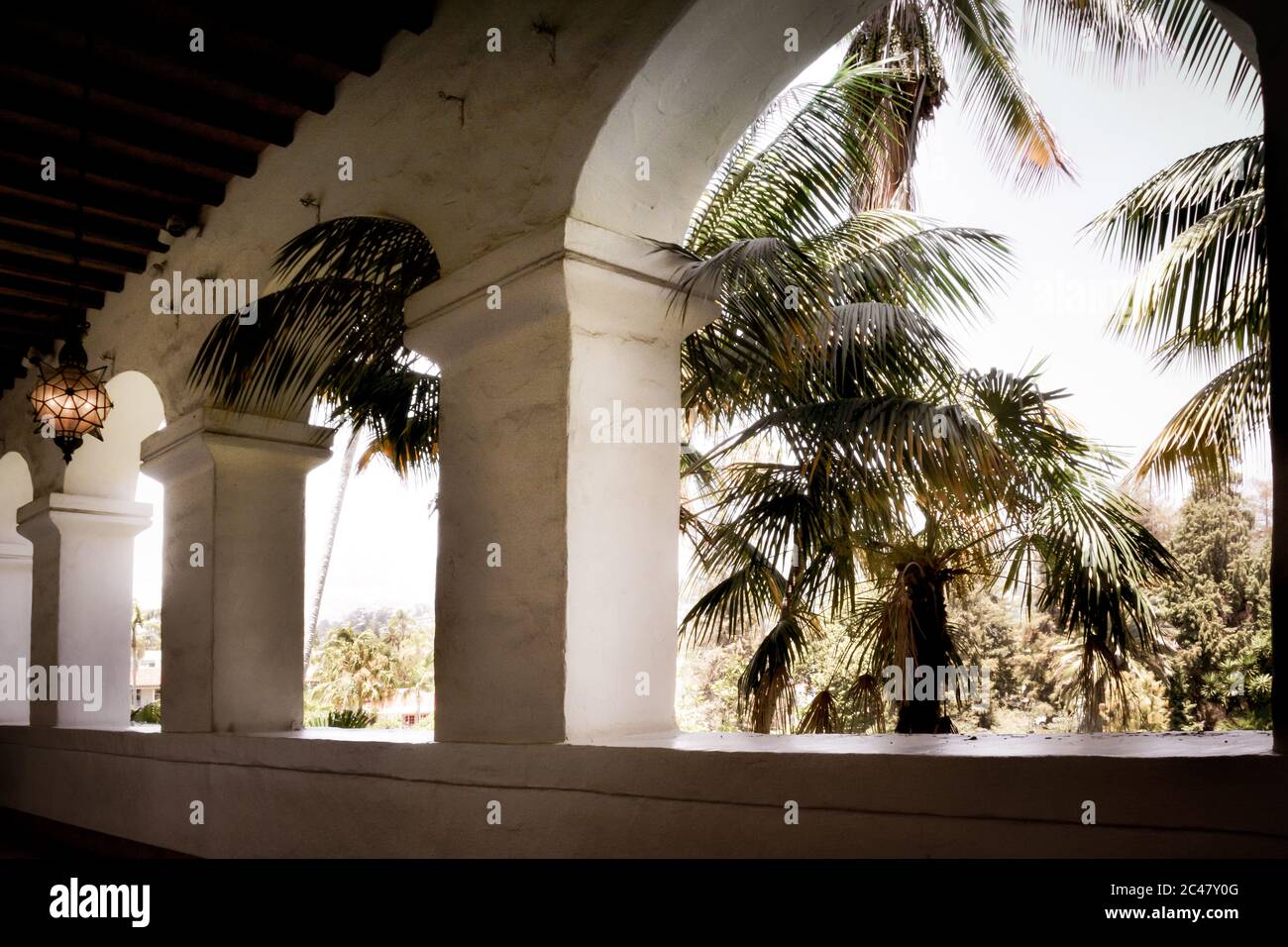View from Spanish Moorish style colonnade with arches and surrounded by ...