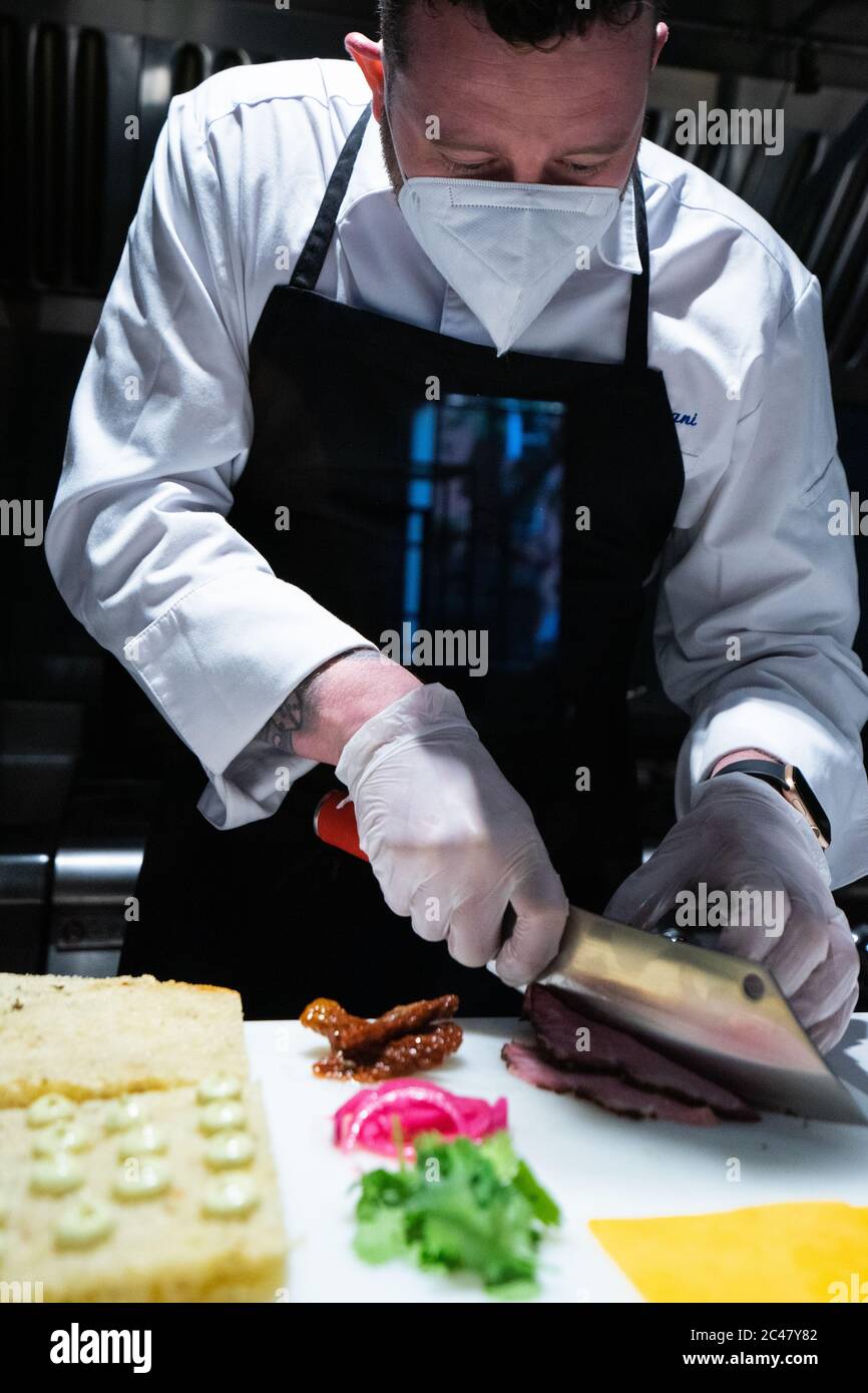 Person wearing gloves slicing hi-res stock photography and images - Alamy