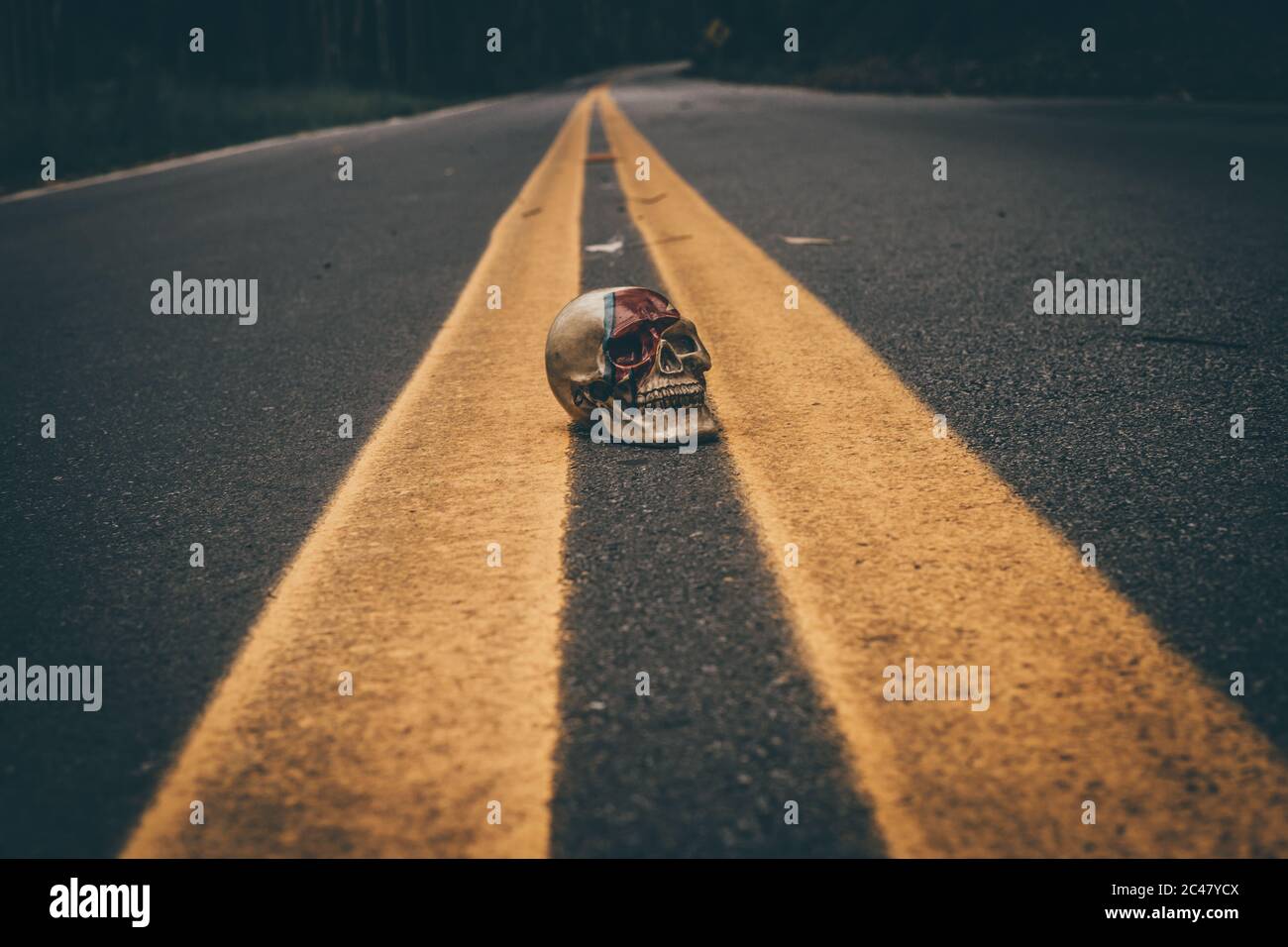 Painted human skull in the middle pf an asphalt road Stock Photo - Alamy