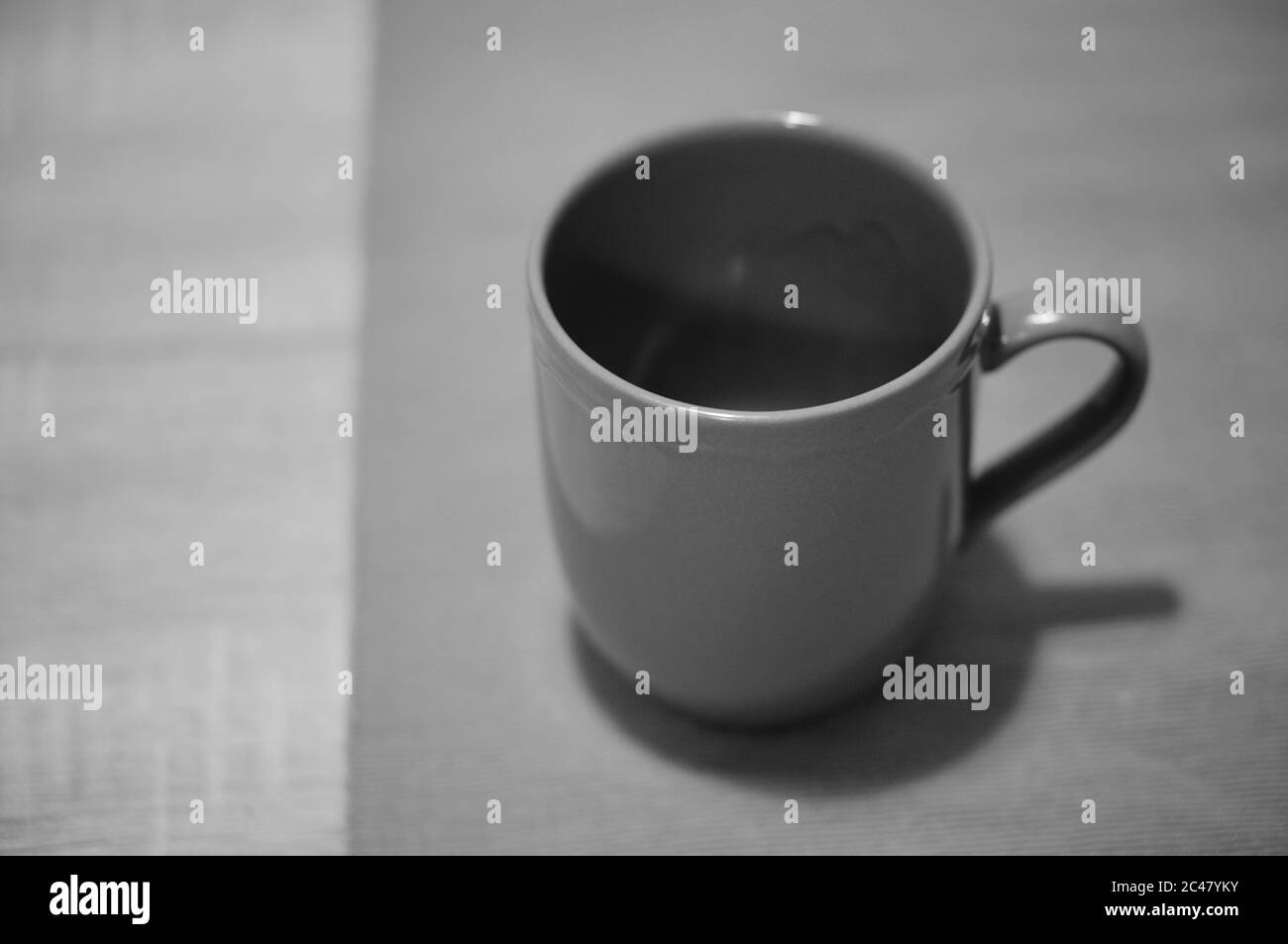 Closeup grayscale shot of an empty mug Stock Photo - Alamy