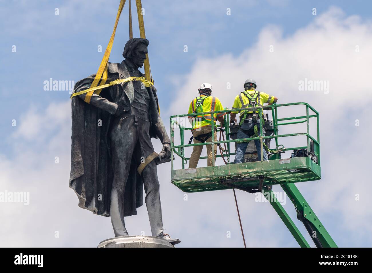 Charleston, United States. 24th June, 2020. Workers operate a stone saw ...
